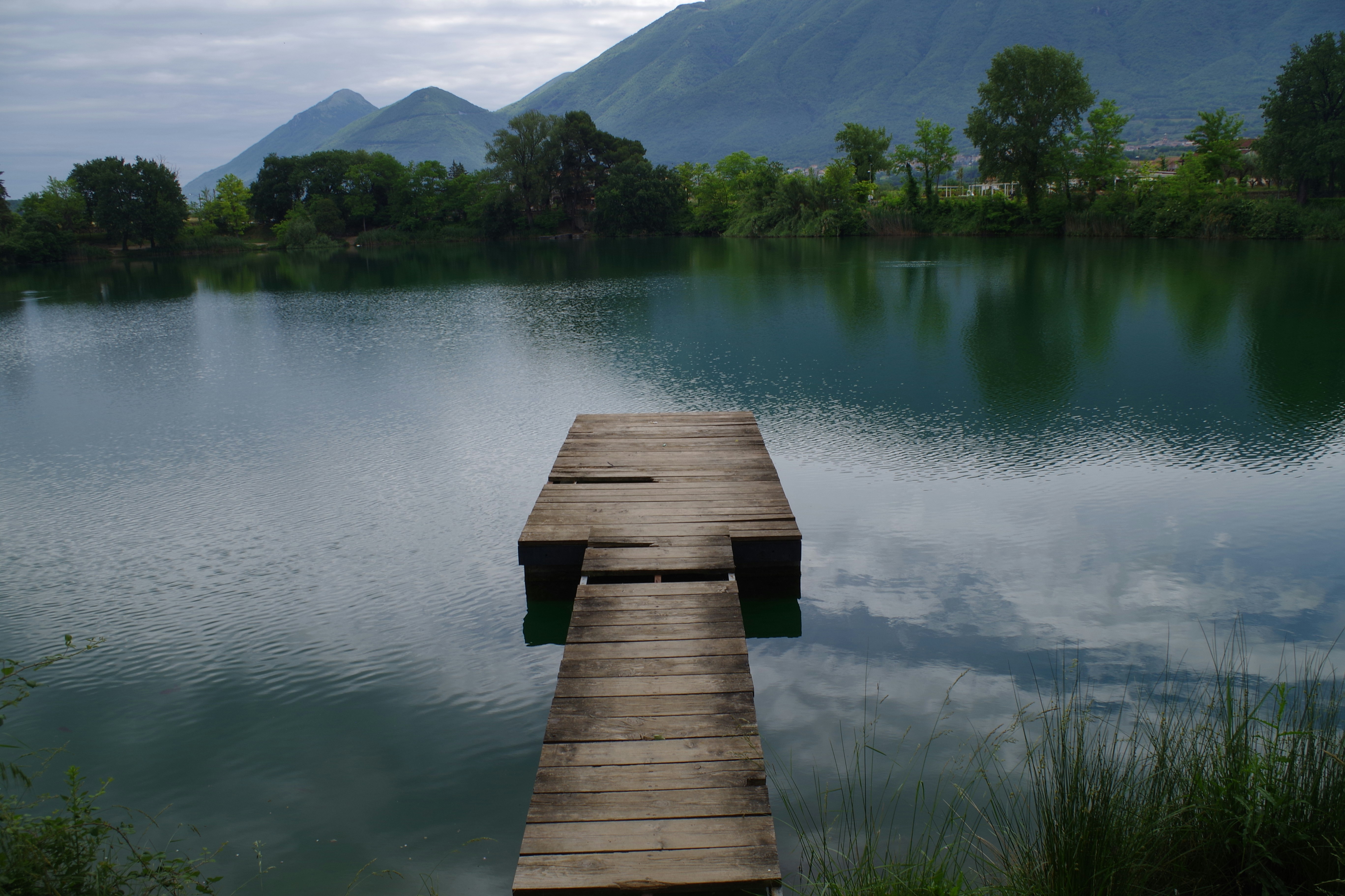 Tranquil Reflections on a Lakeside Pier