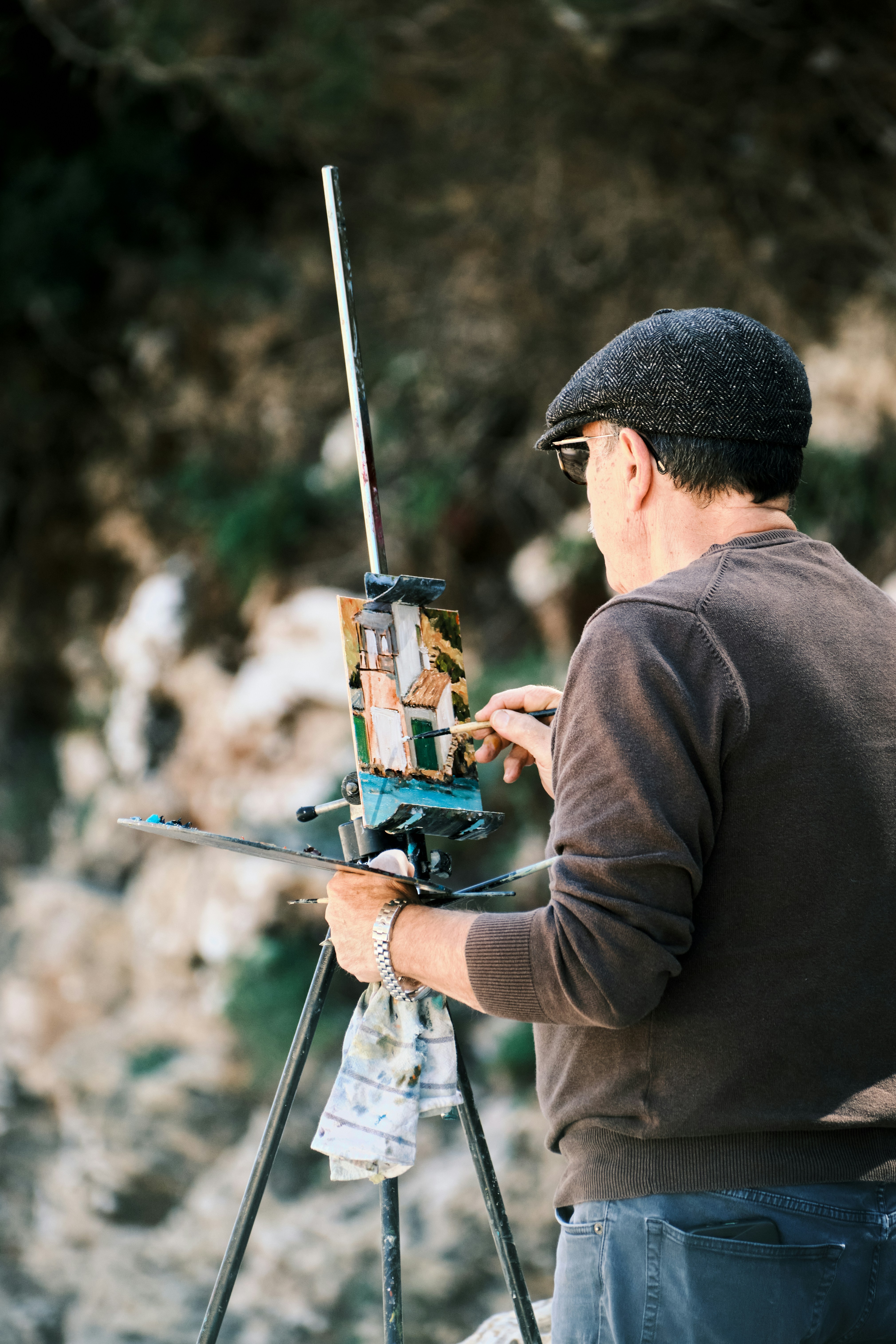 Studio of the Sea Cliff: An Artist at Work on a Sunlit Portrait