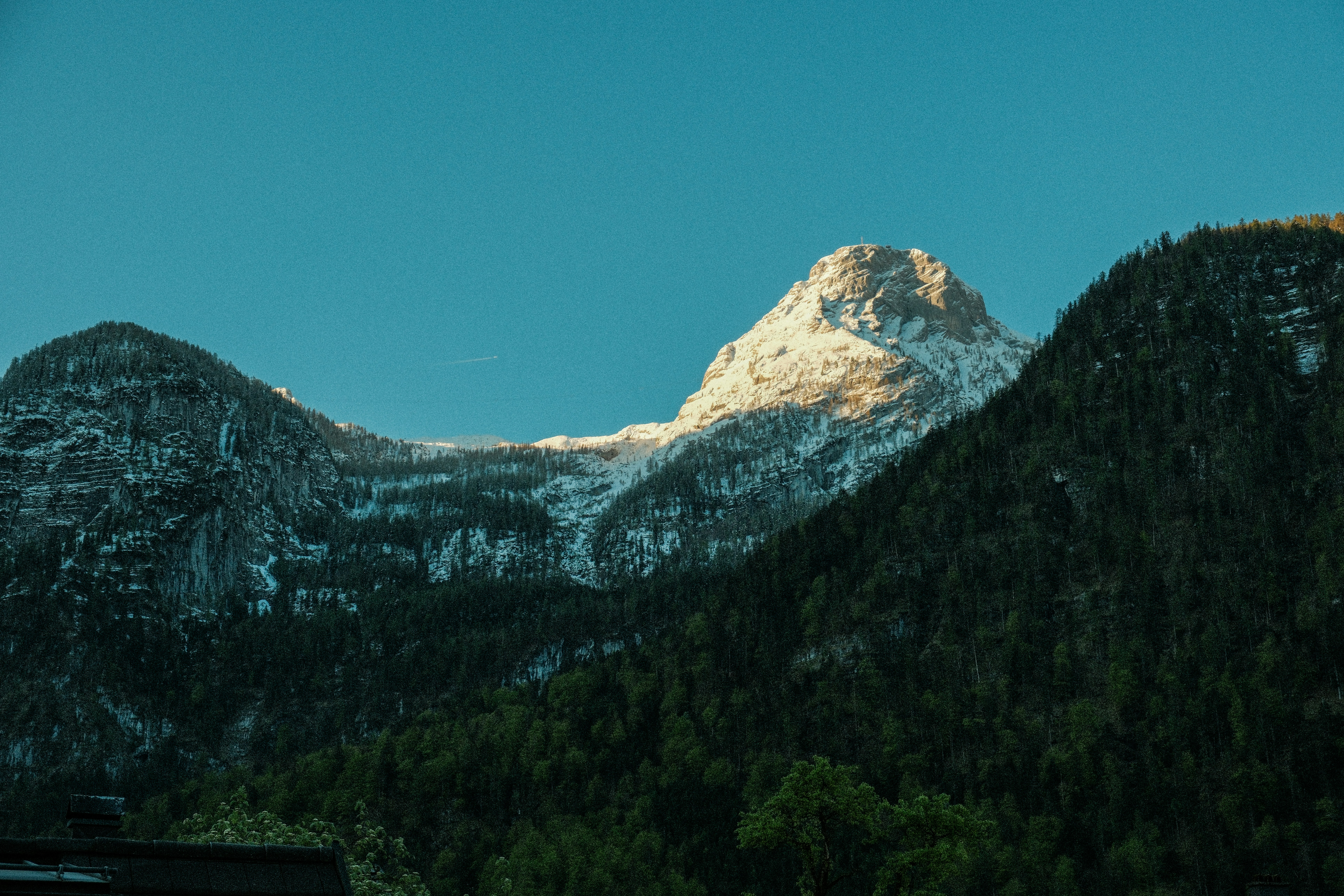 Dawn Crown on a Snow-Dusted Alpine Peak