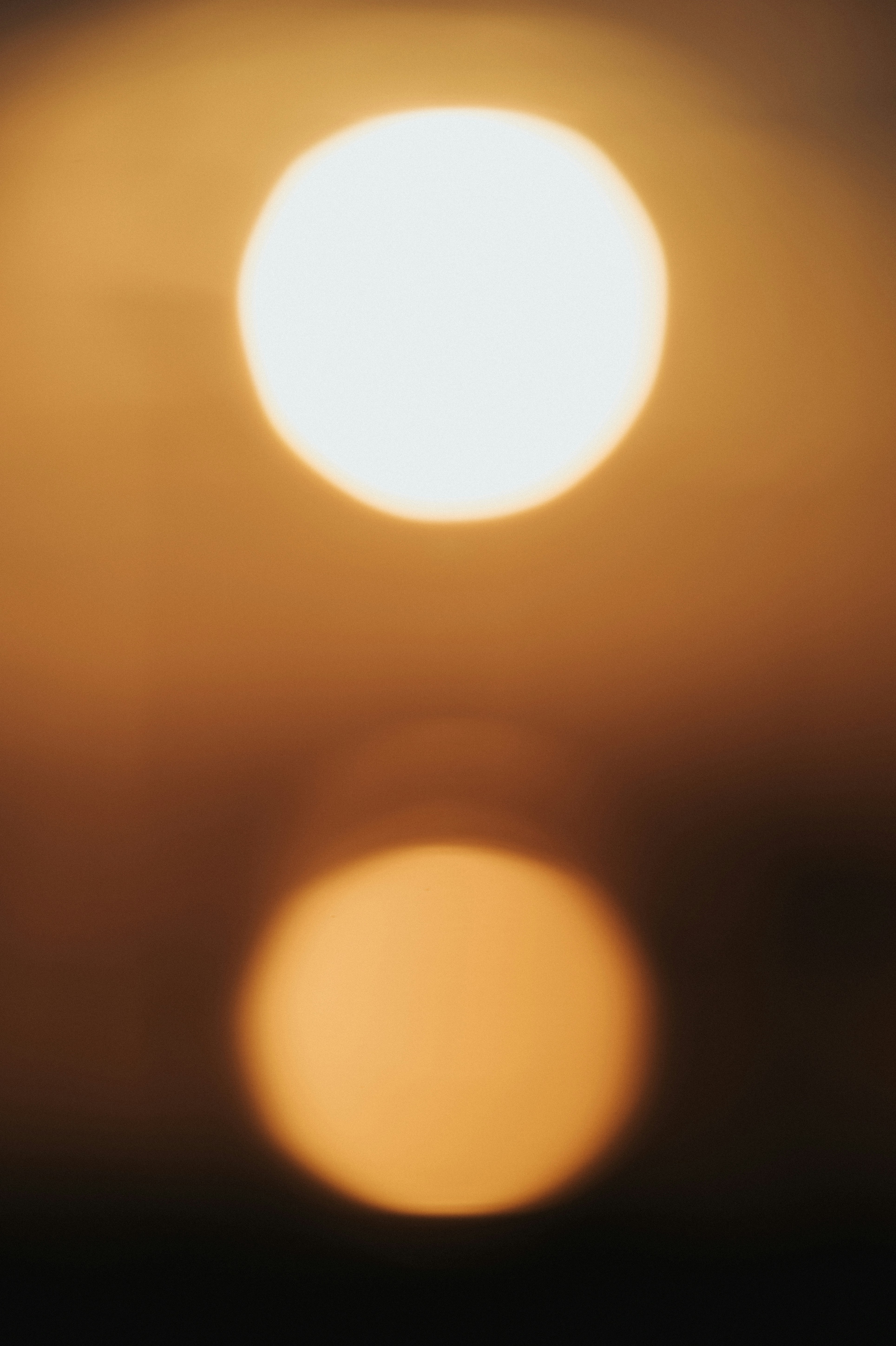 Twin Orbs of Sunset Glow in a Velvet Blur