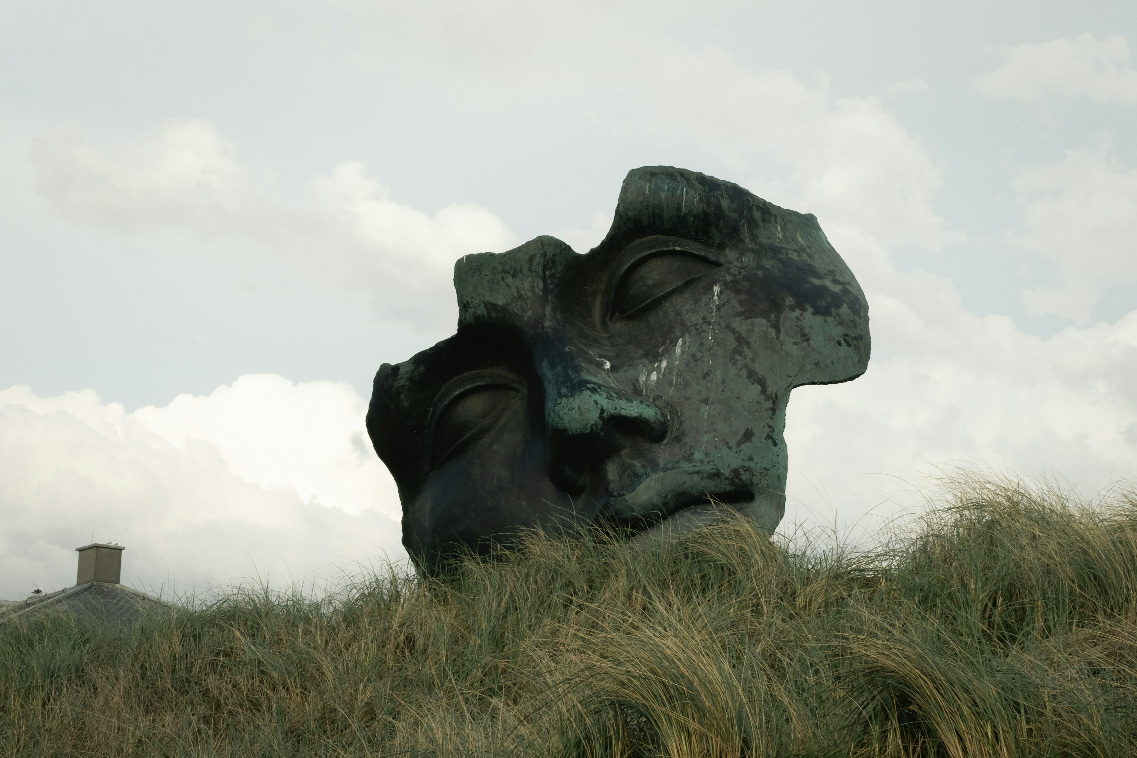 Emergence of a Weathered Head Above Coastal Dunes