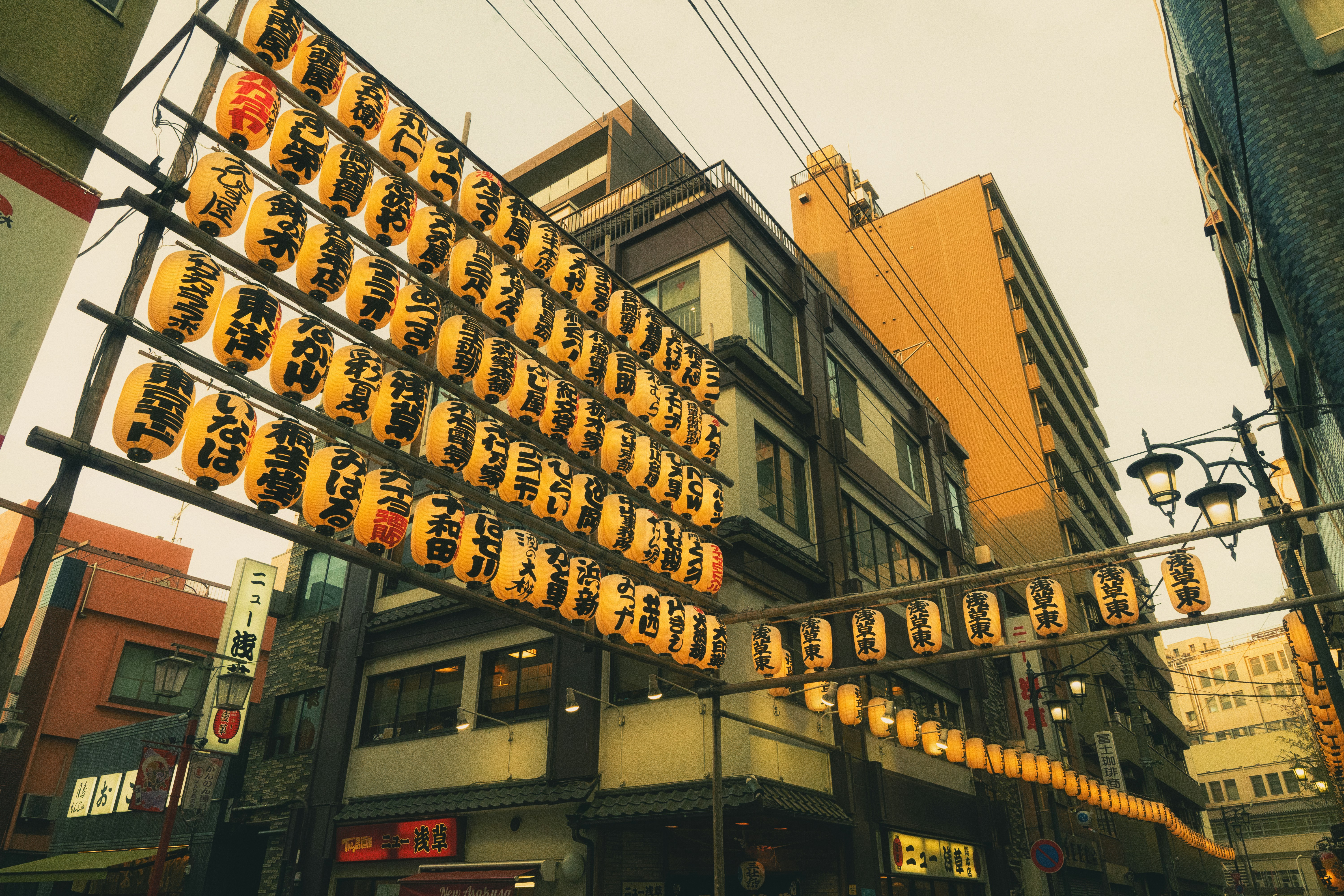 A street sign with chinese characters hanging from it's sides photo ...