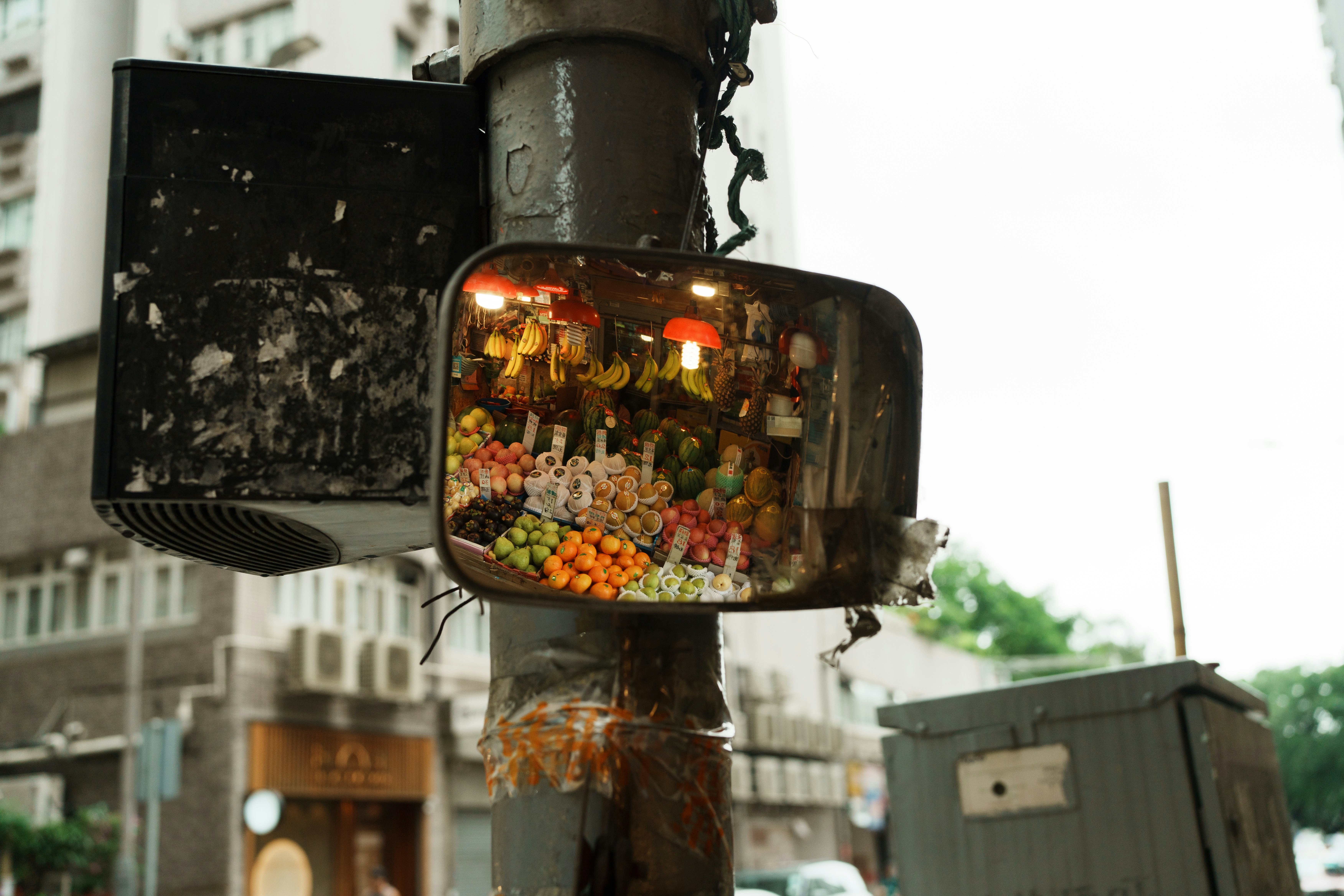 A traffic light with a bunch of fruit on it photo – Free Hong kong ...