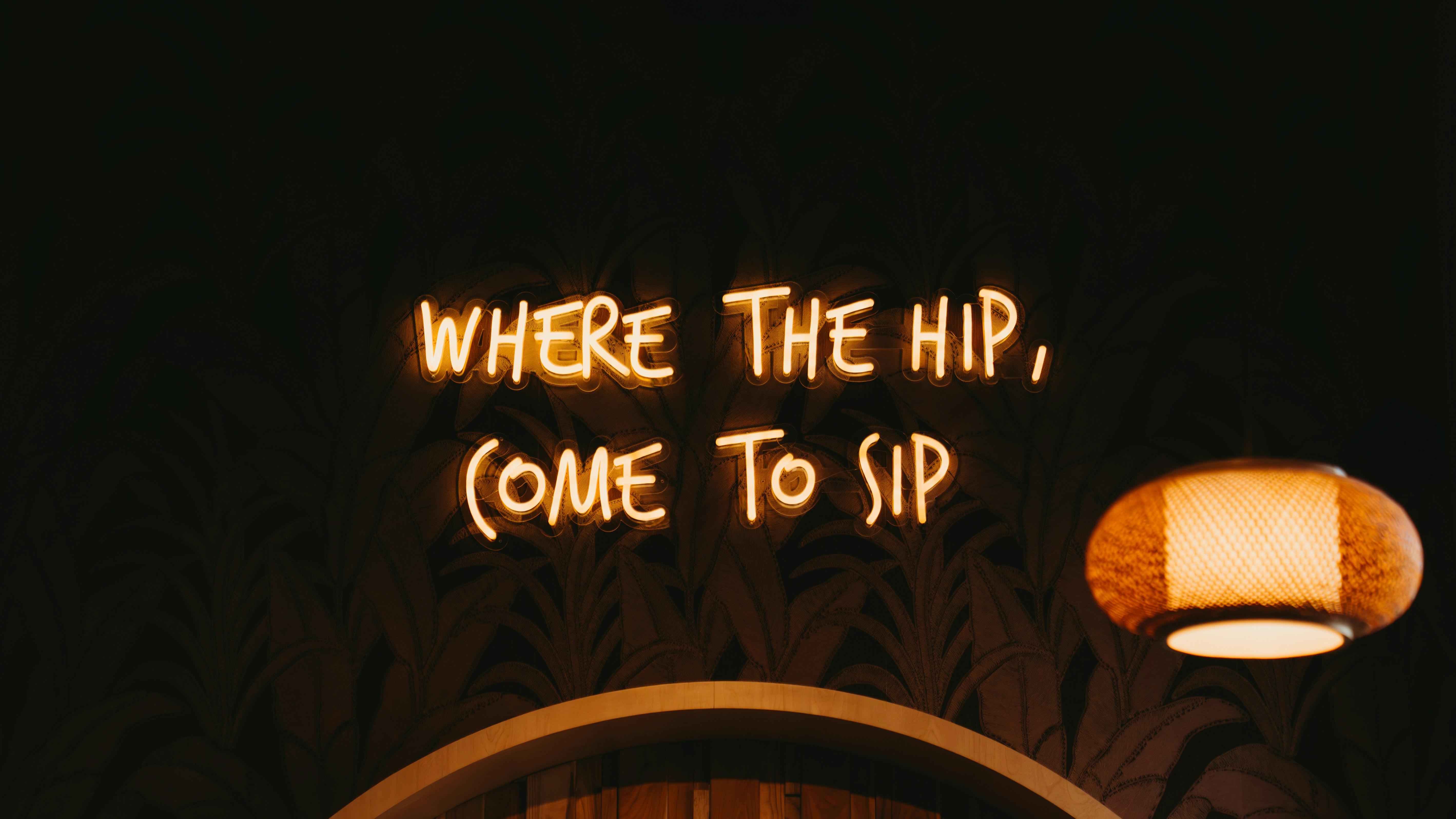 A neon sign that says where the hip, come to sip photo – Free Garage ...