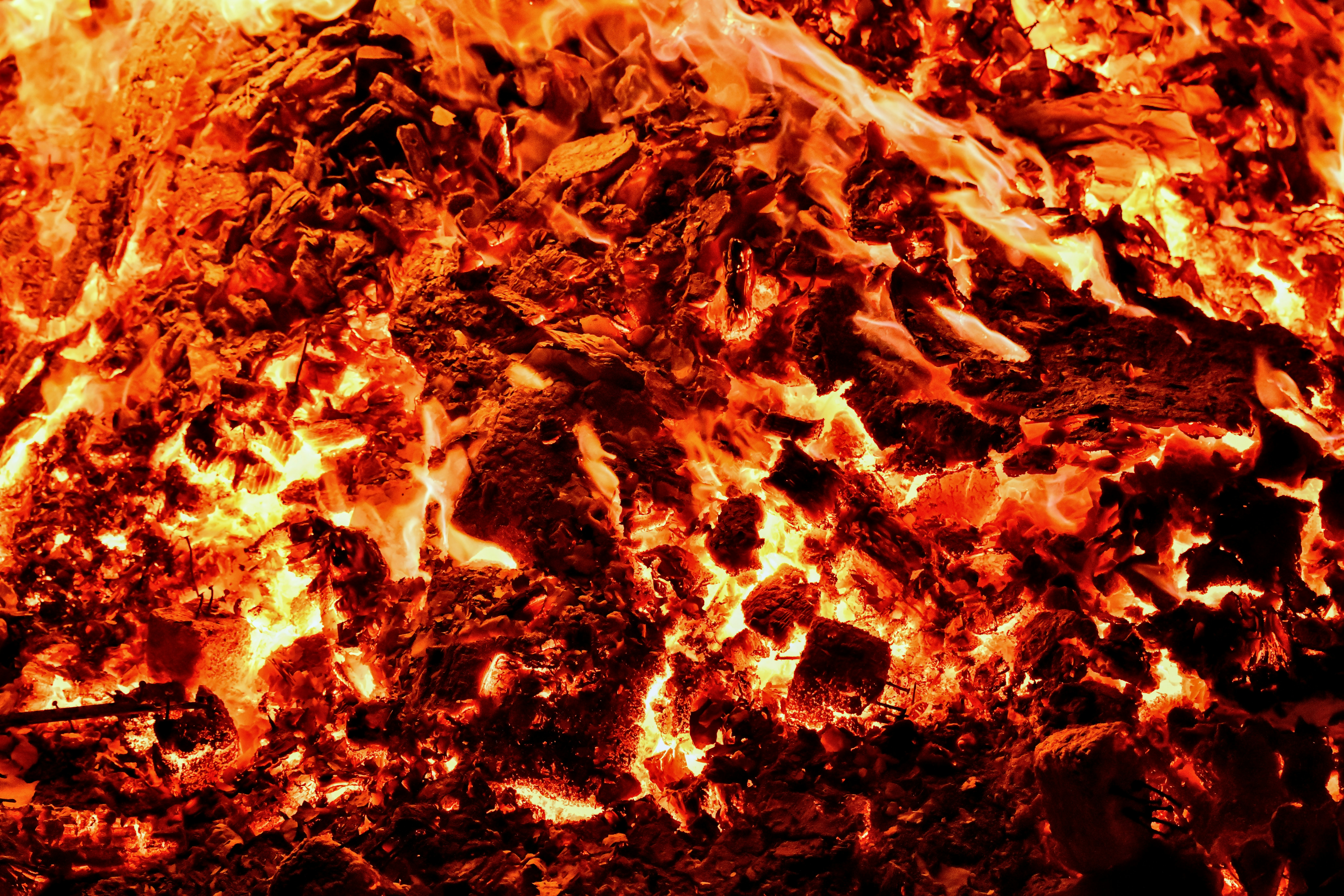 Inferno Portrait: Close-up of molten embers and char
