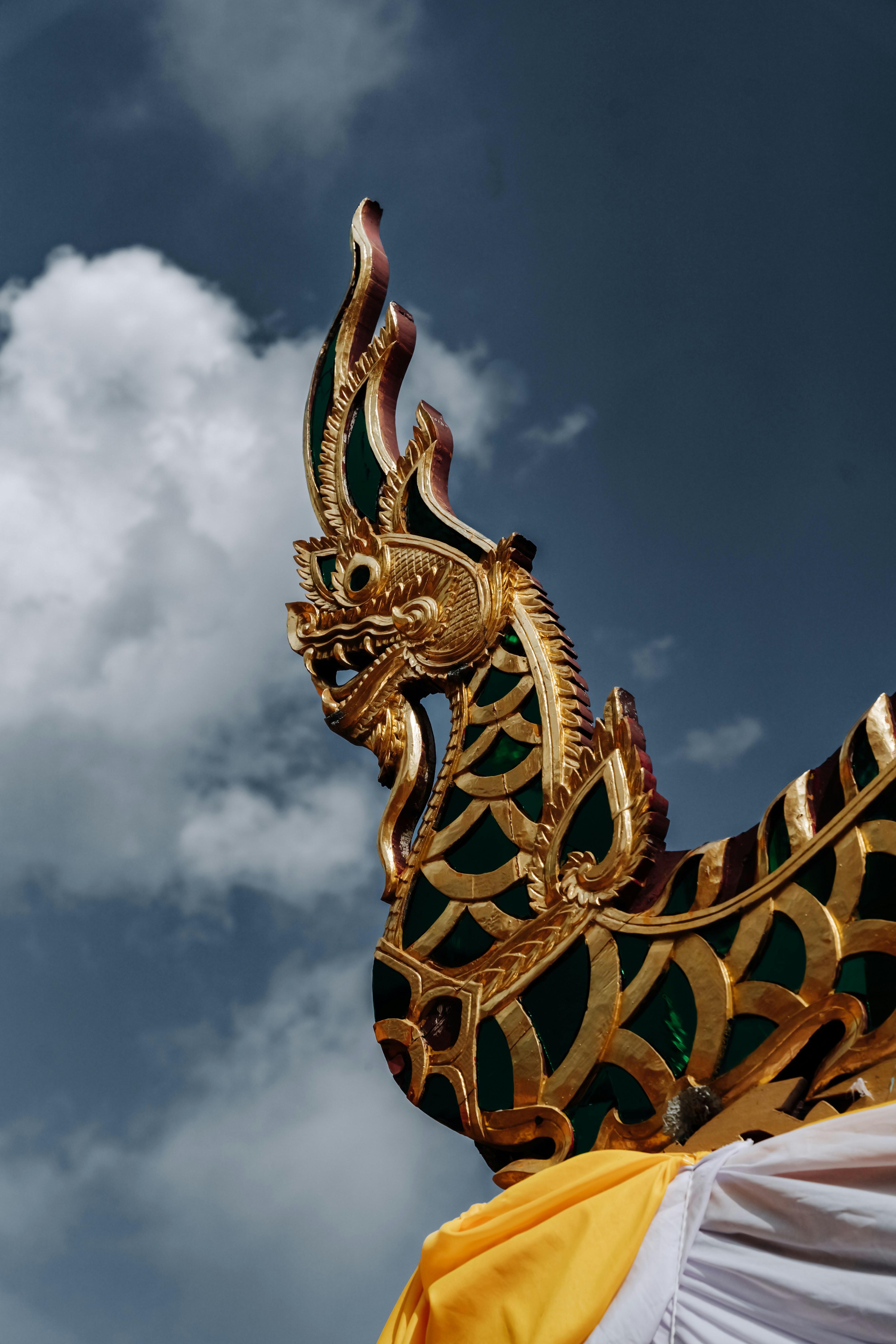 Sunlit Gilded Dragon: A Temple Ornament Reaching Toward the Sky