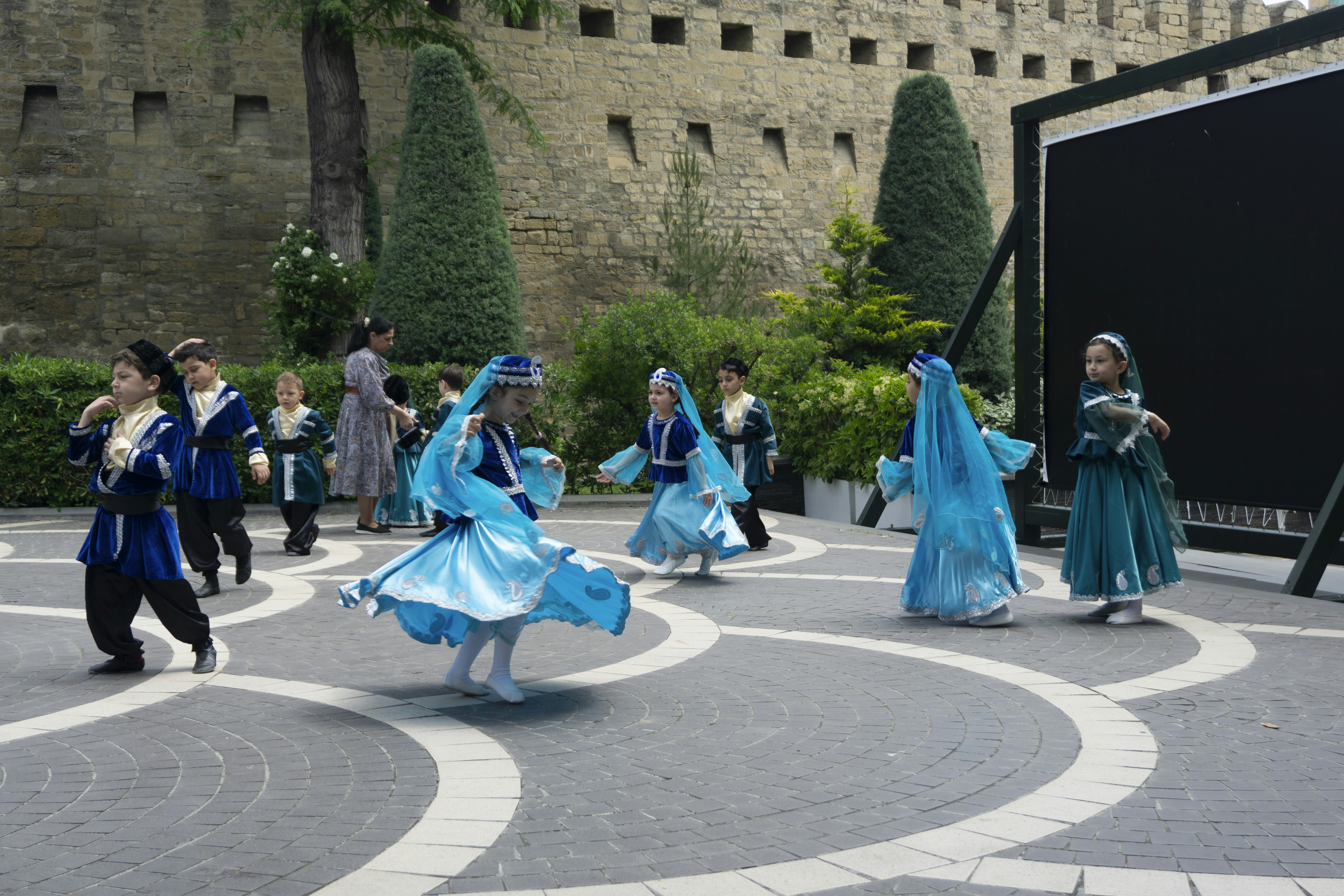 A group of people dressed in blue dancing photo – Free Photography ...