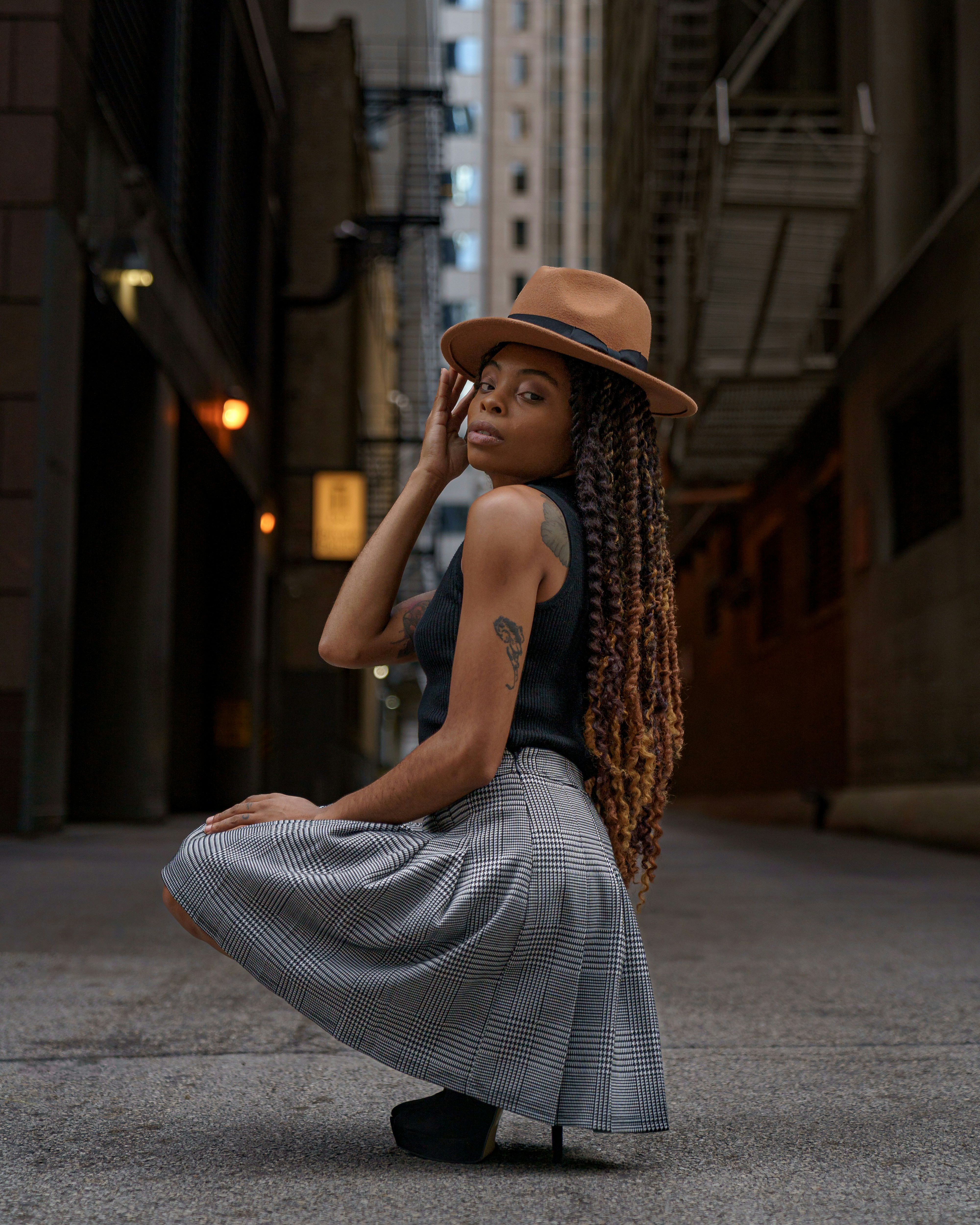 Urban Grace: A Portrait in Plaid and Brick