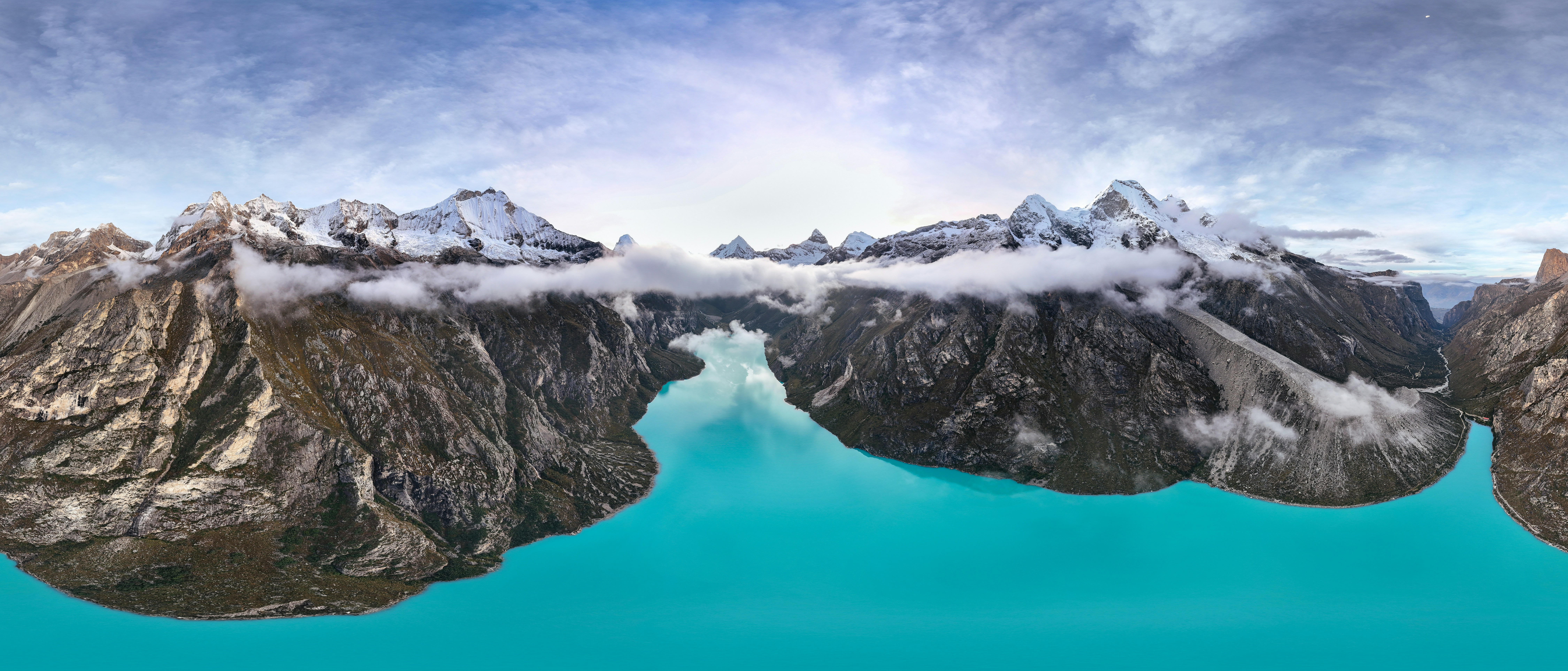 "Turquoise Milk" A morning panorama of Laguna Paron, framed by surrounding mountains. From this high altitude, the lake's turquoise color resembles a sea of smooth, wave-free milk.
