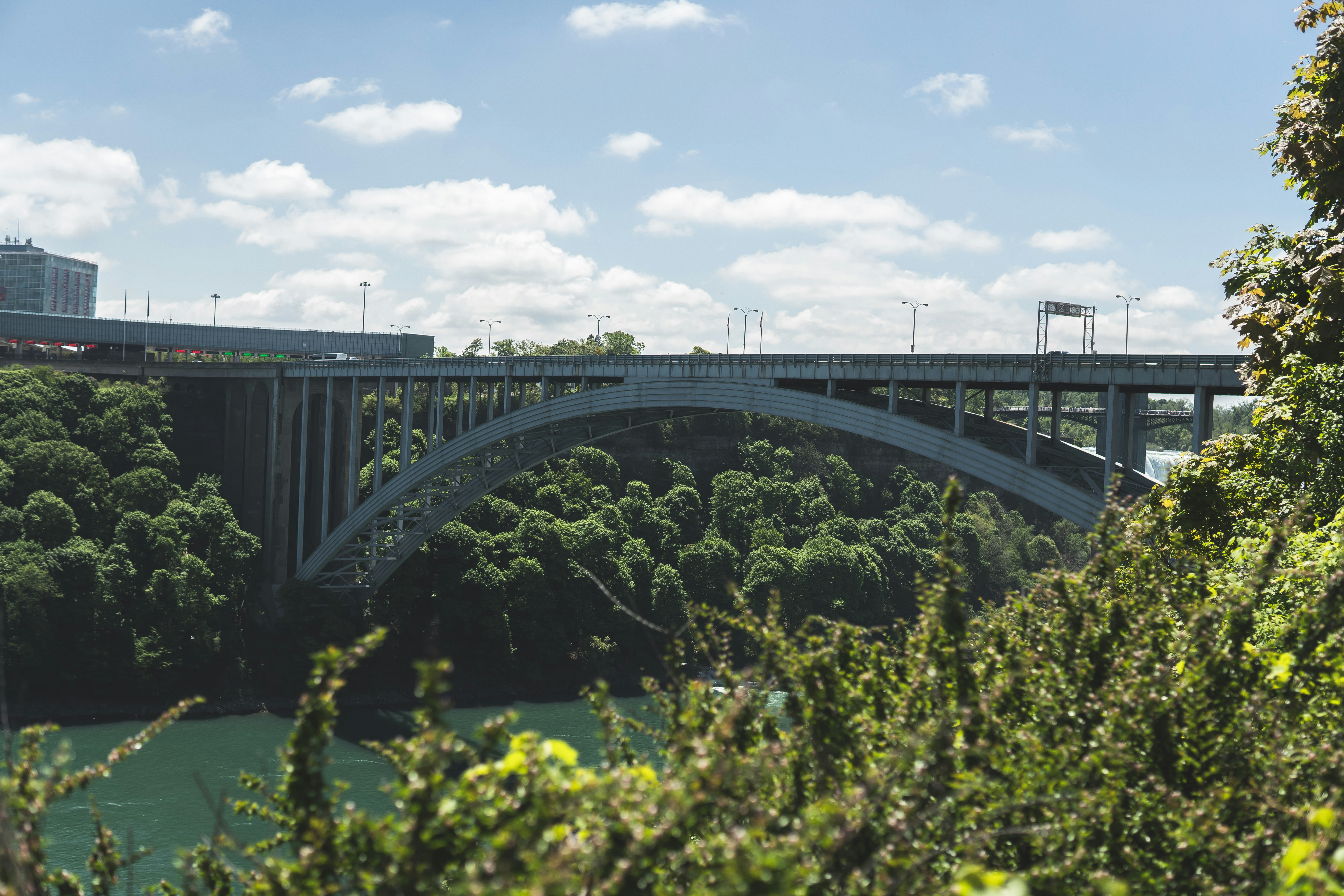 A bridge over a river with a bridge in the background photo – Free ...