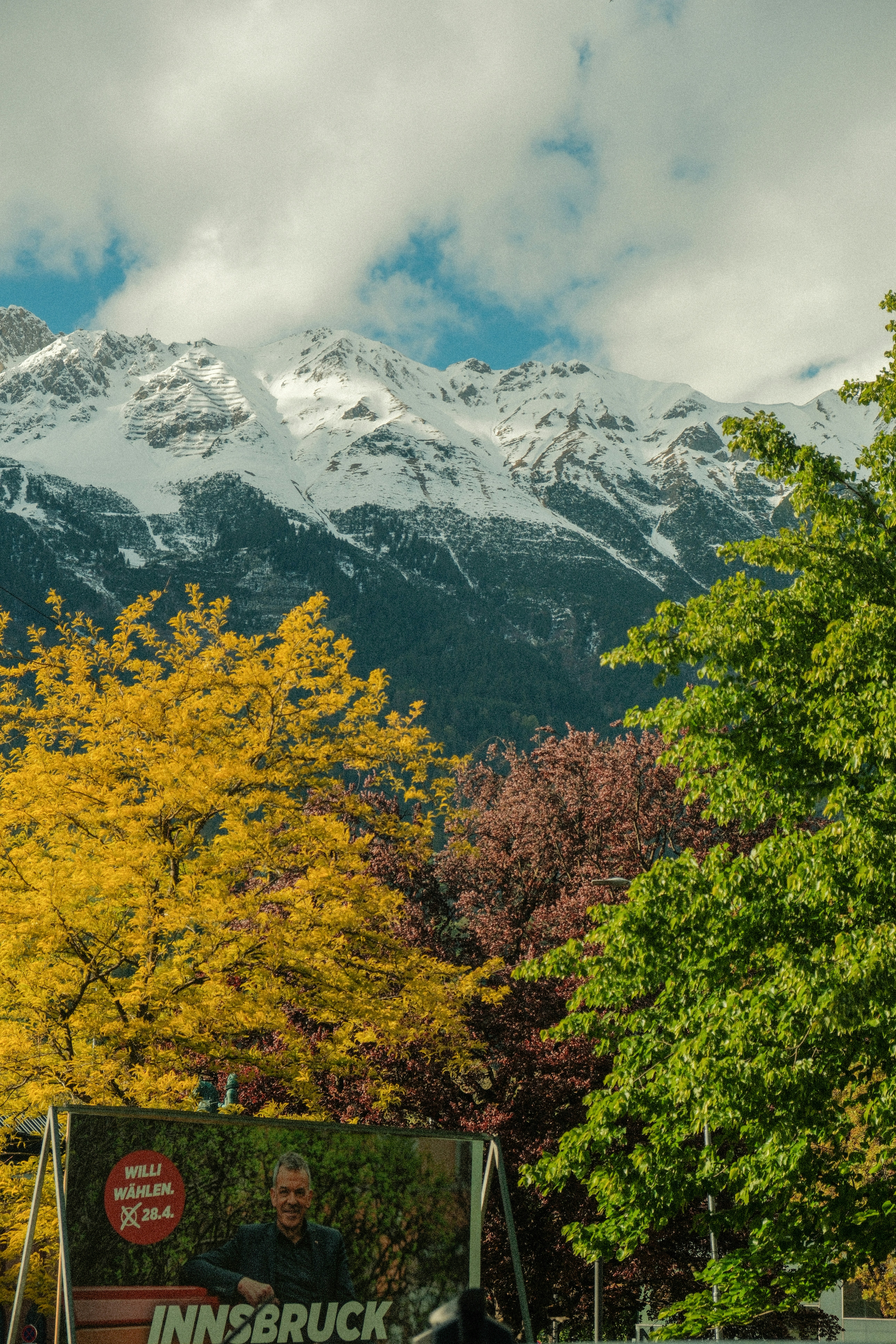 Autumn Parked in Front of Alpine Snowcaps