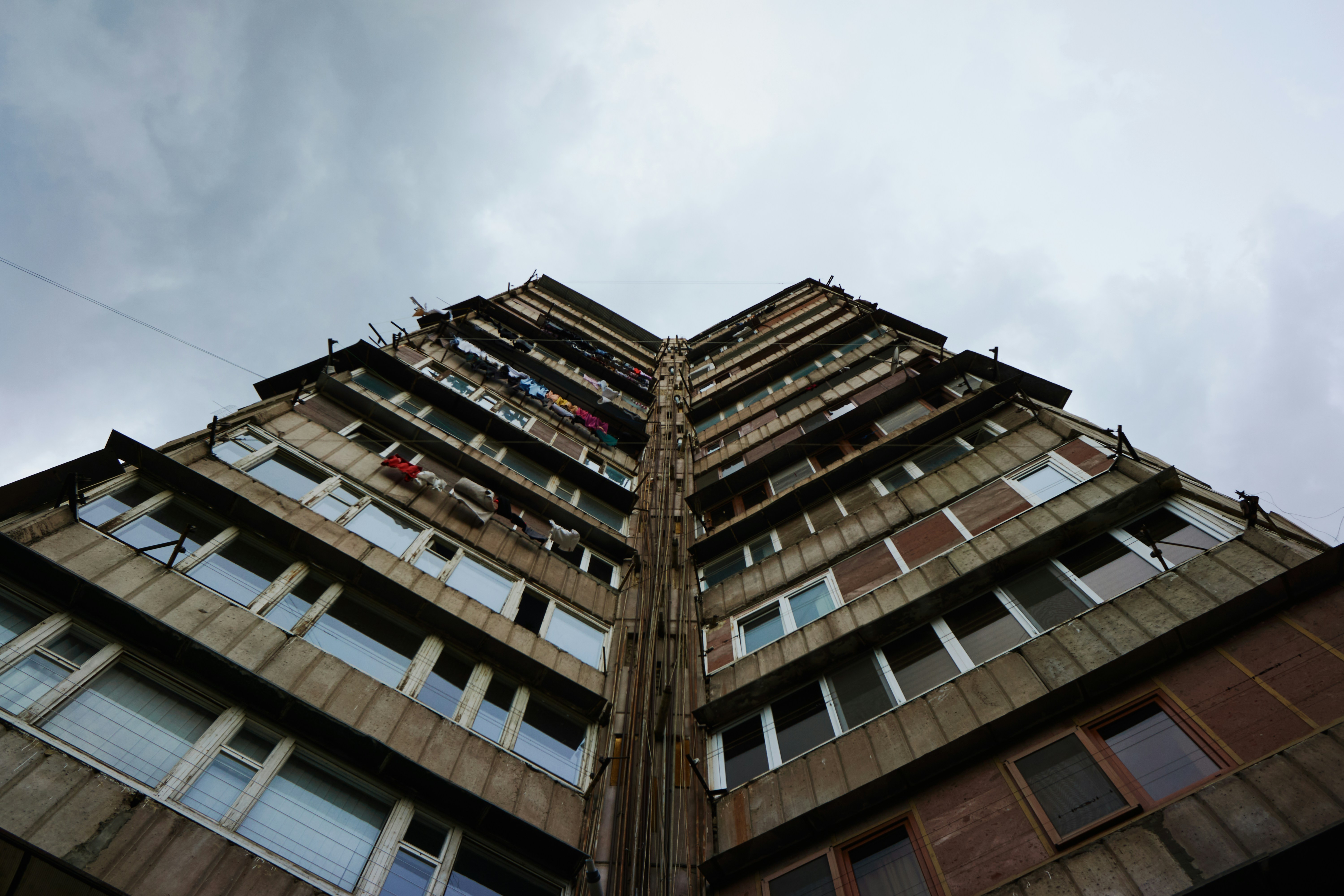 Vertical Convergence: The Brick Facade Reaching Toward the Sky