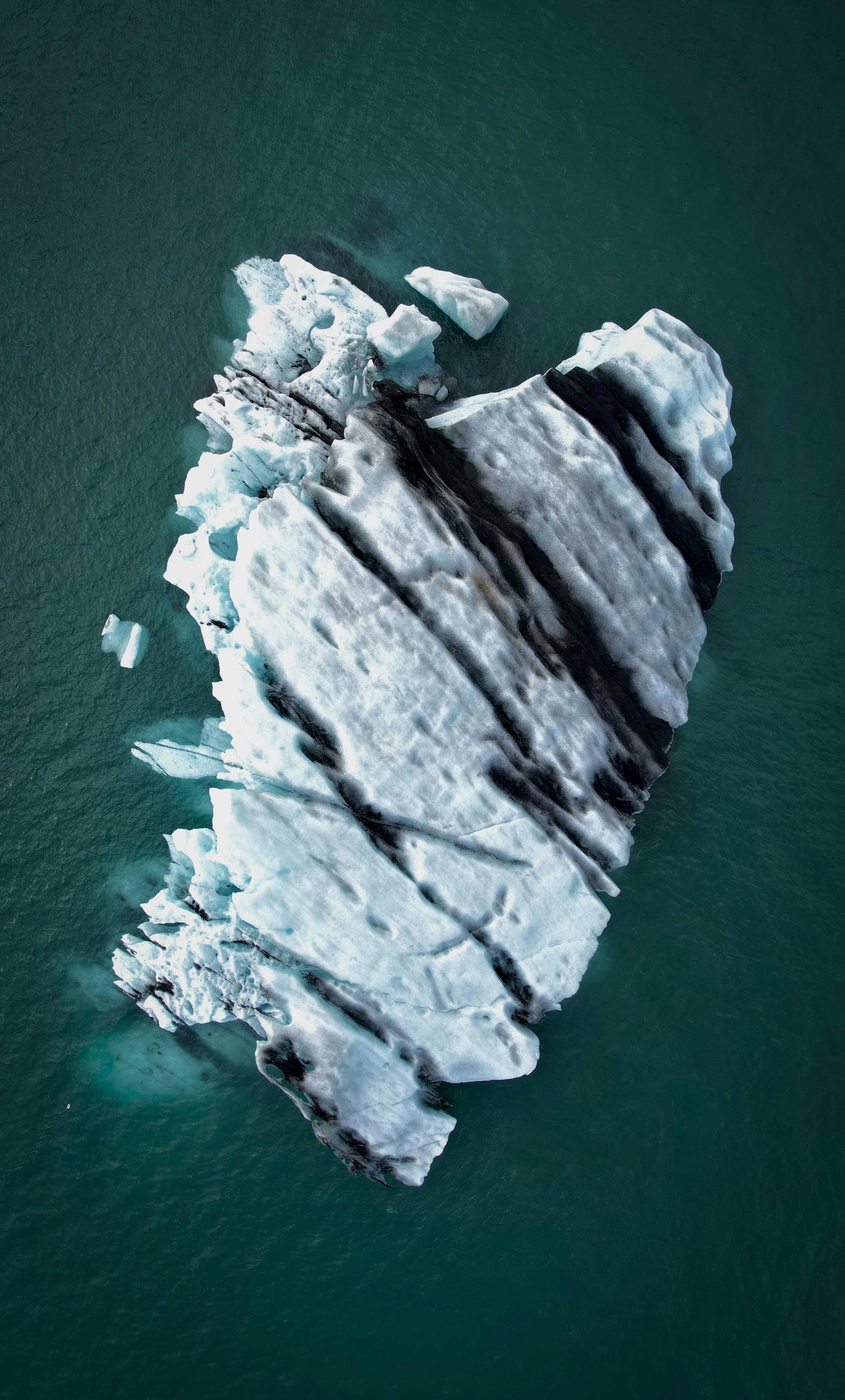 Diagonal Iceberg: Shadows in a Teal Ocean