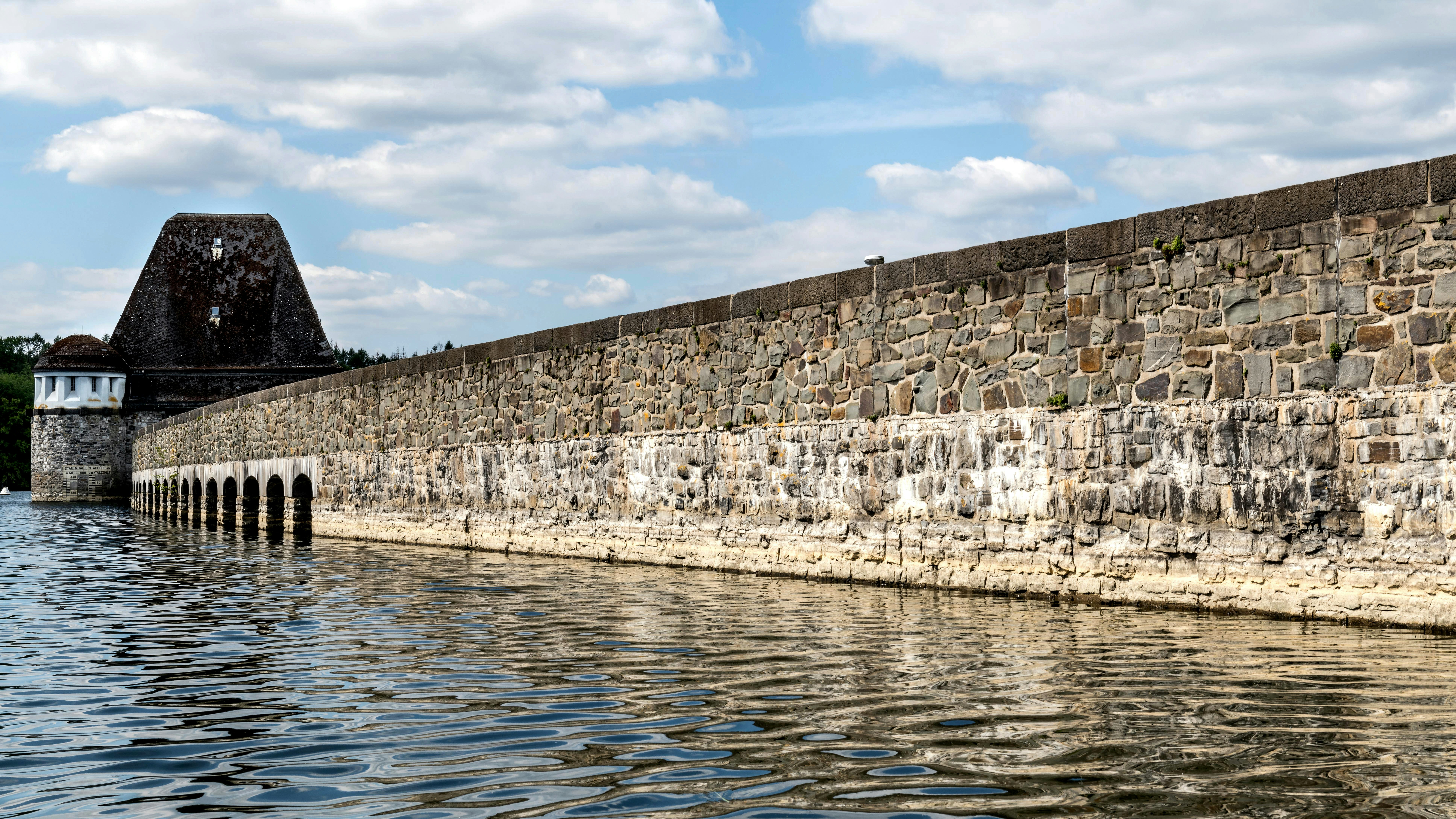 Stone Sentinel Along the Inlet: Fortress Wall Meets a Glassy Channel