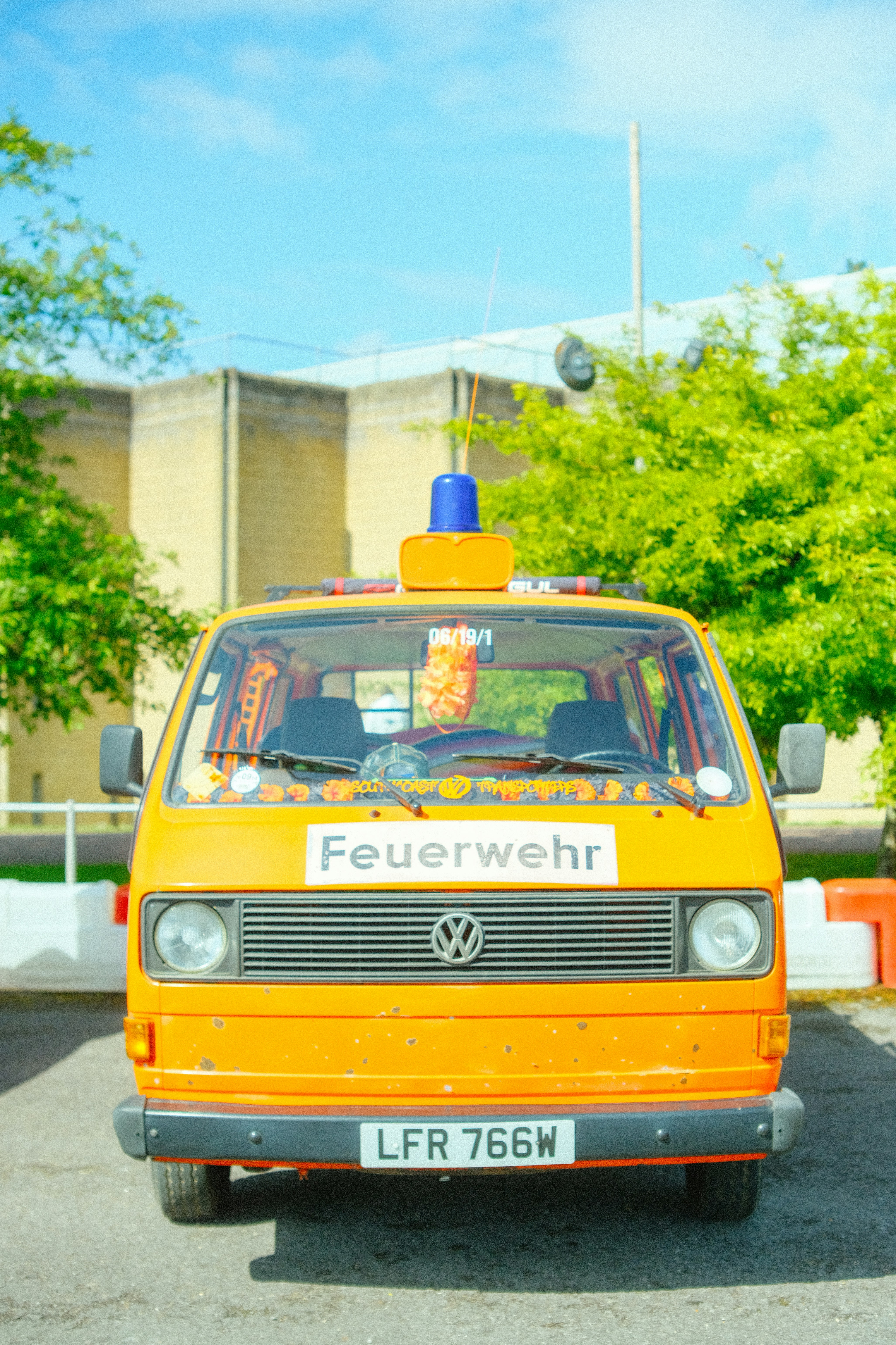 Orange Fire Truck Front and Center Under Bright Sky