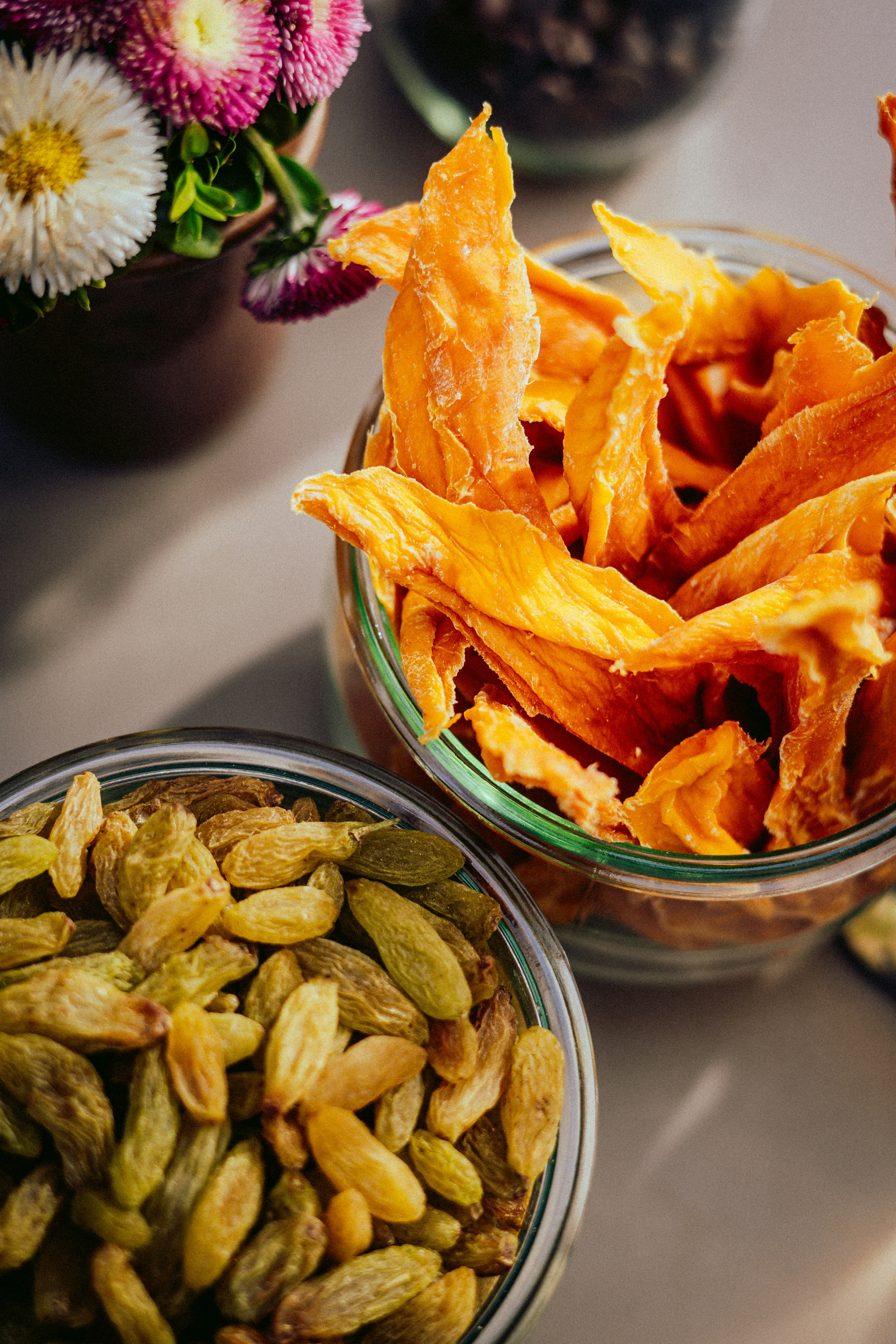 Crisped Vignettes: Orange Shards and Green Pellicles in Glass Bowls