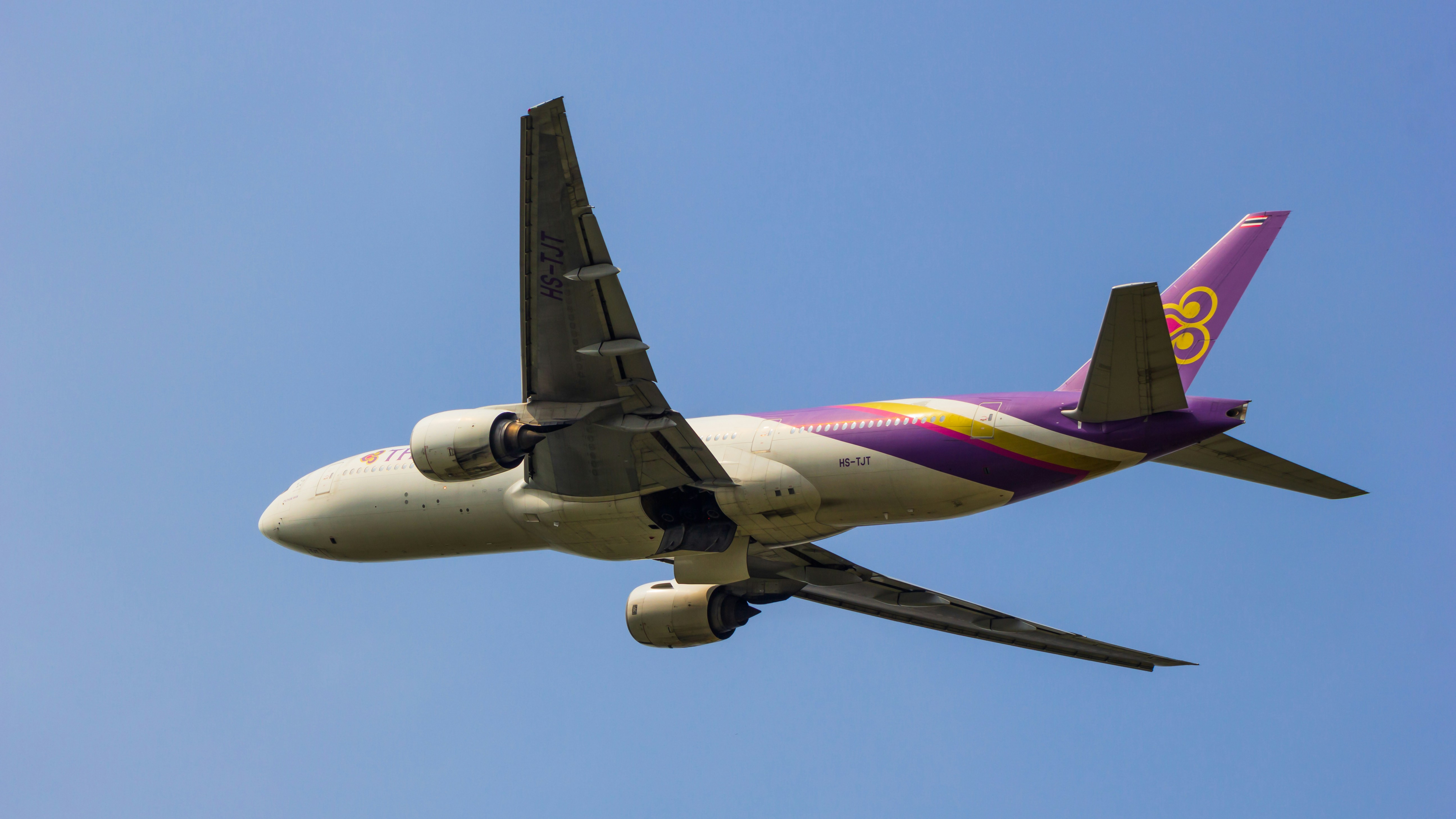 A large passenger jet flying through a blue sky photo – Free Aircraft ...