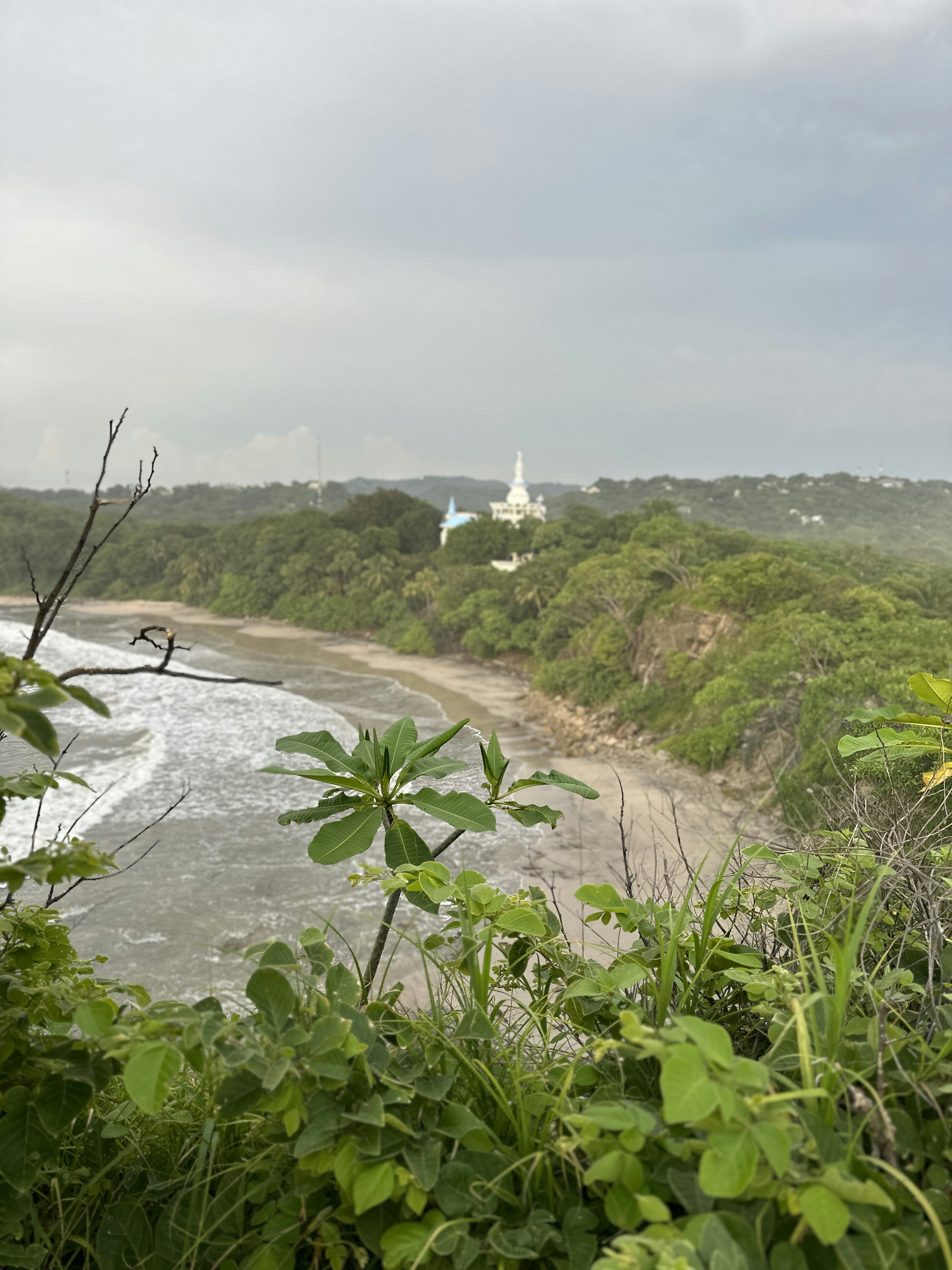 Blue-Roofed Shrine Aloft on a Green Coastal Bluff