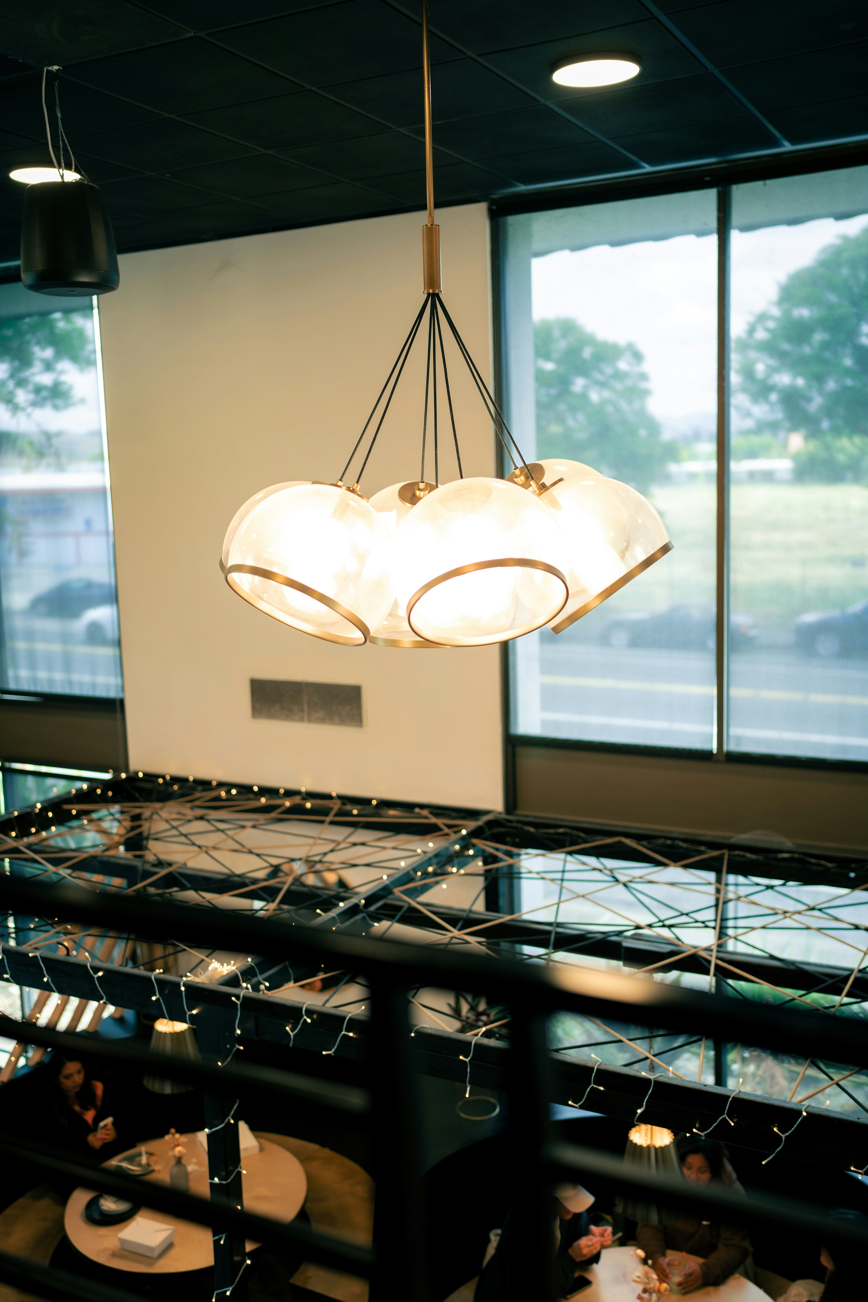 Clustered Pendant Globe Casting Warm Glow in a Modern Atrium