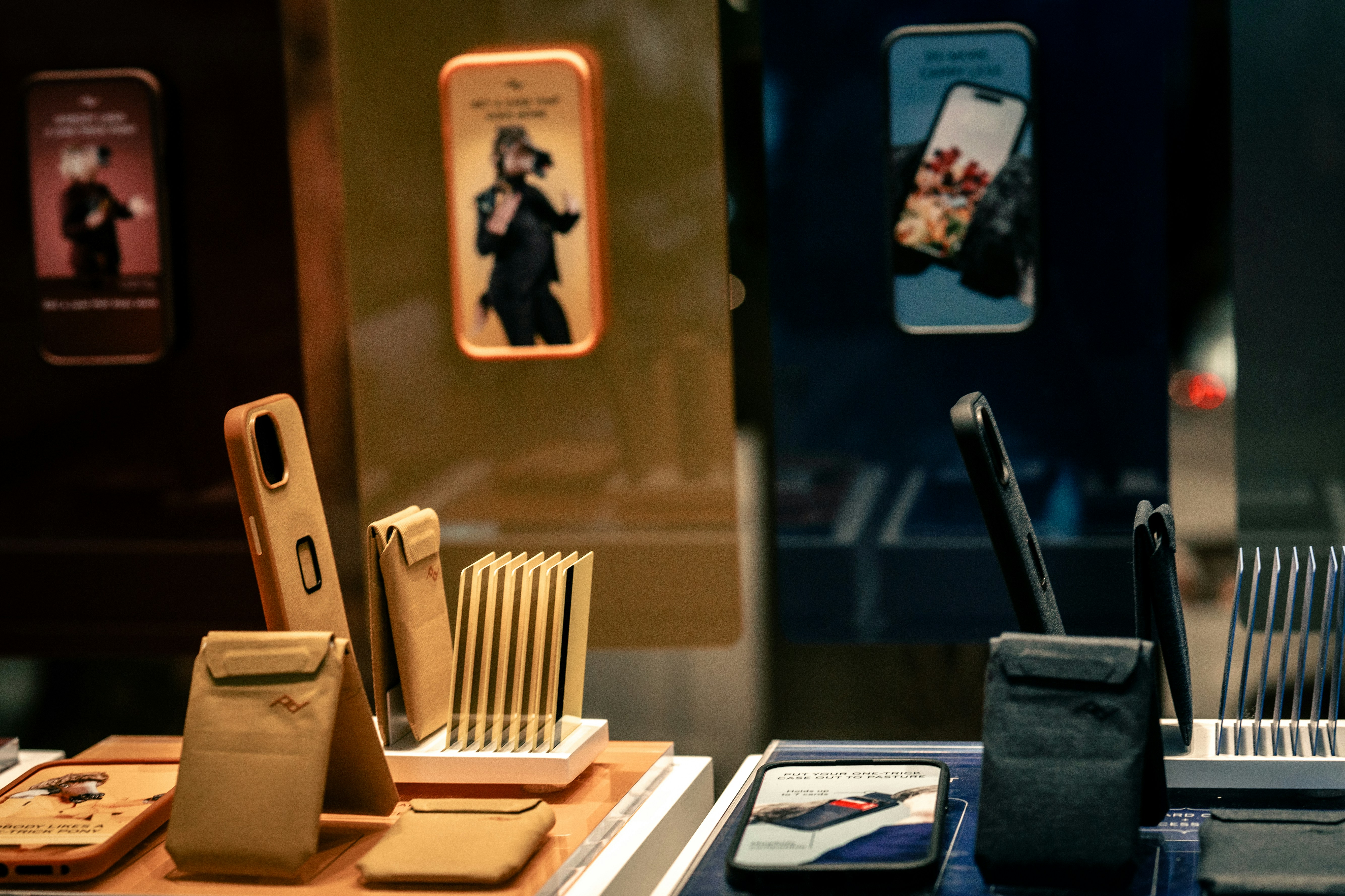 A display of cell phones in a store window photo – Free Human Image on ...