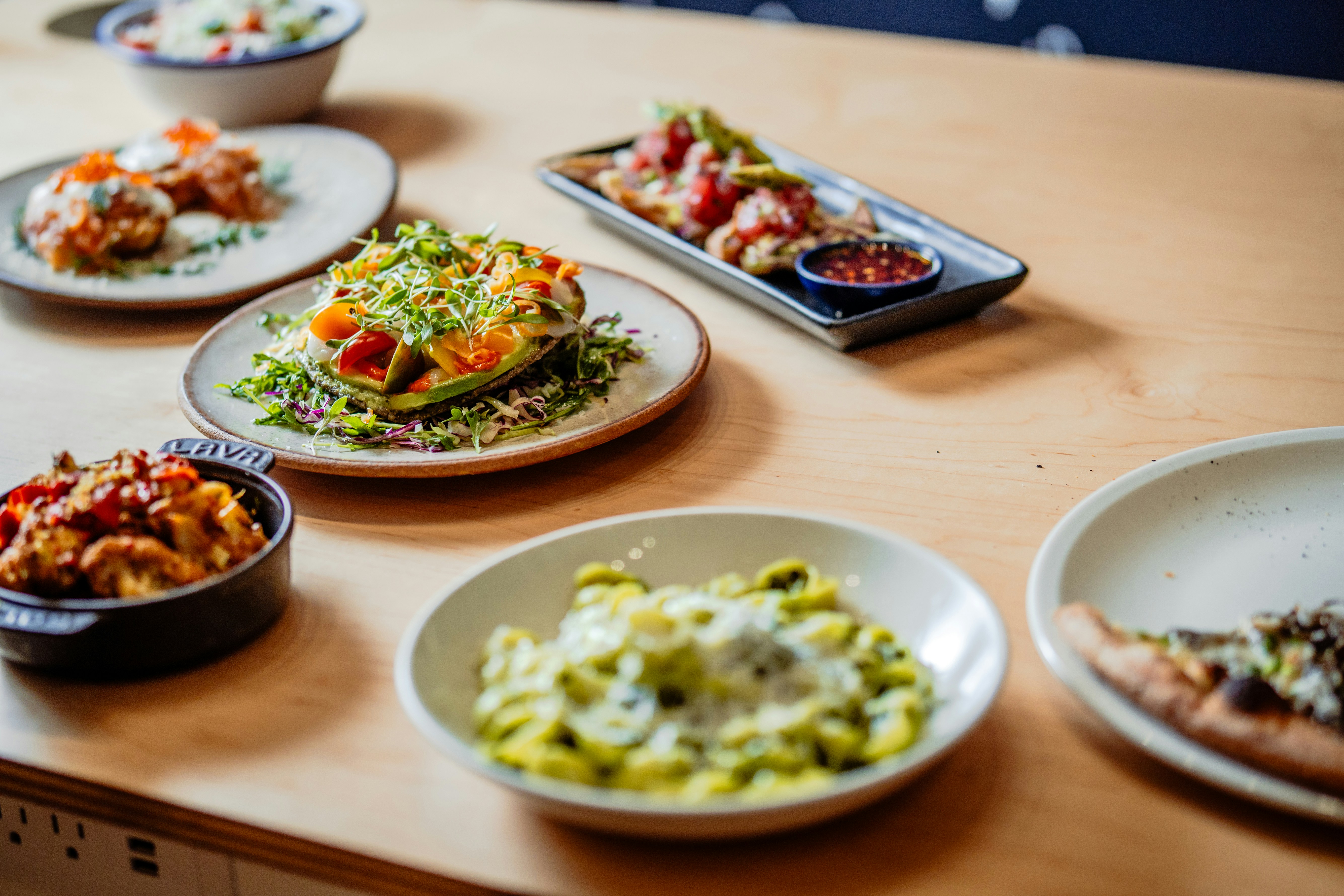 A wooden table topped with plates of food photo – Free Brunch Image on ...
