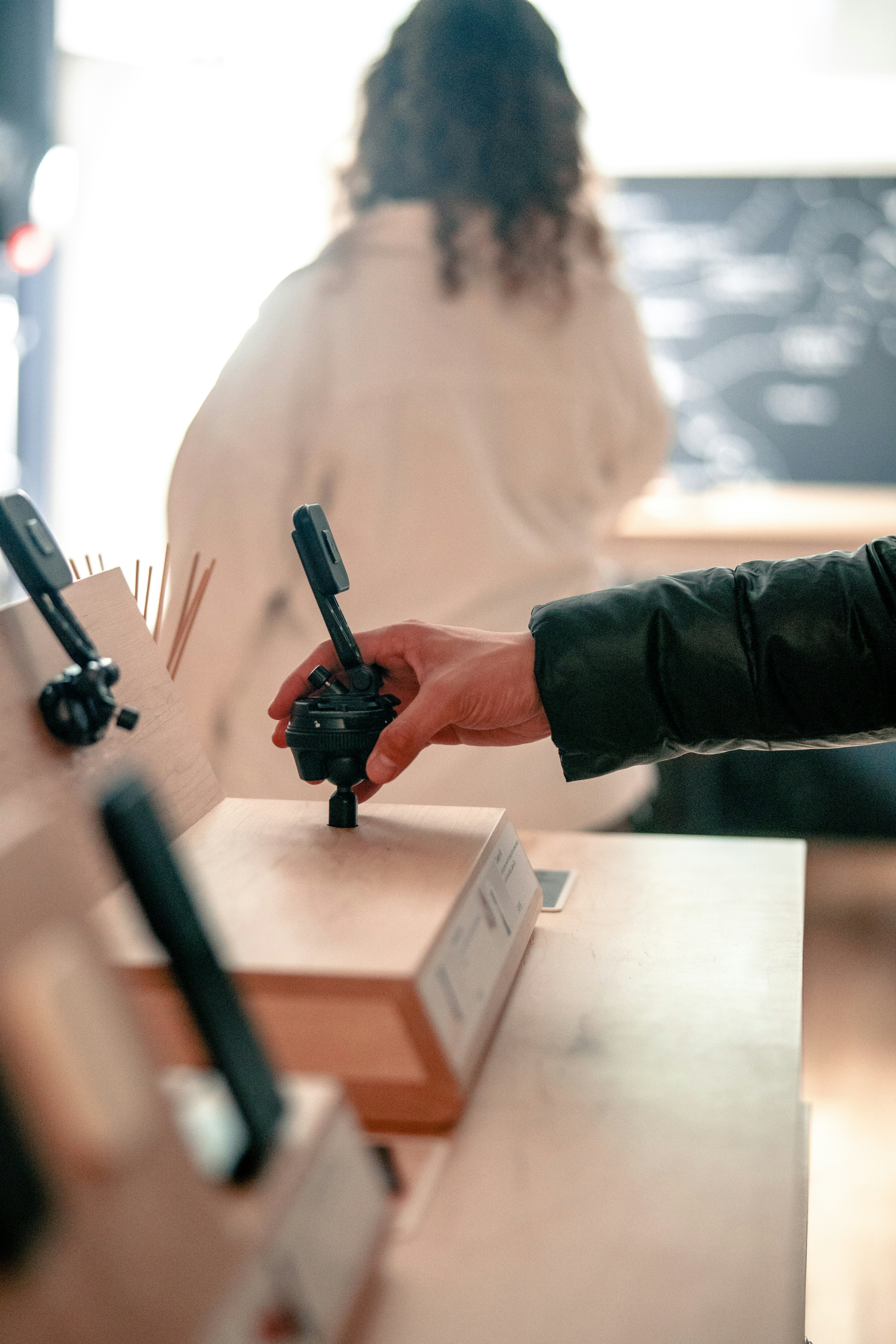 Hand on a Compact Mount: A Close-Up of Precision at the Display Block