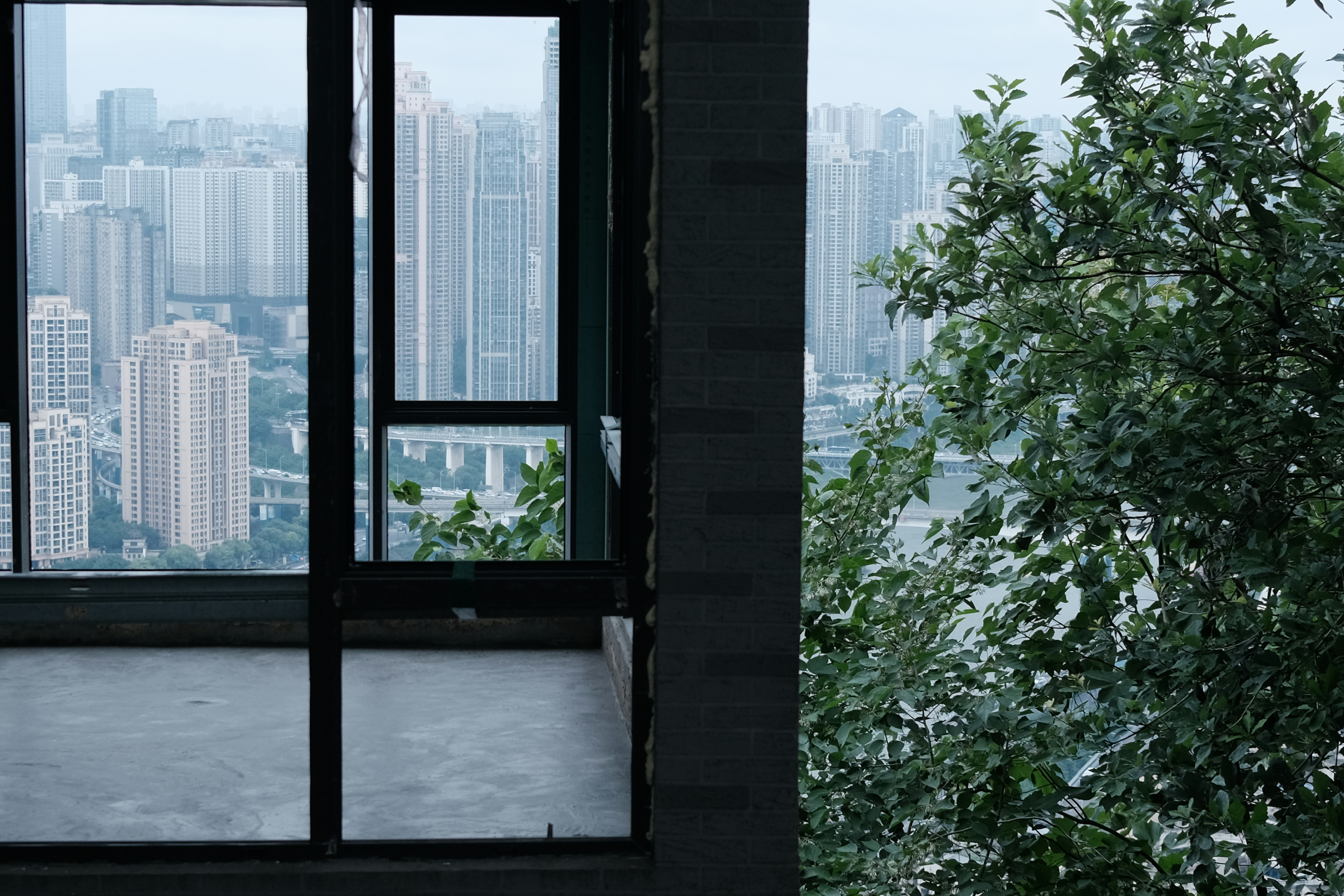A window with a view of a city photo – Free City Image on Unsplash