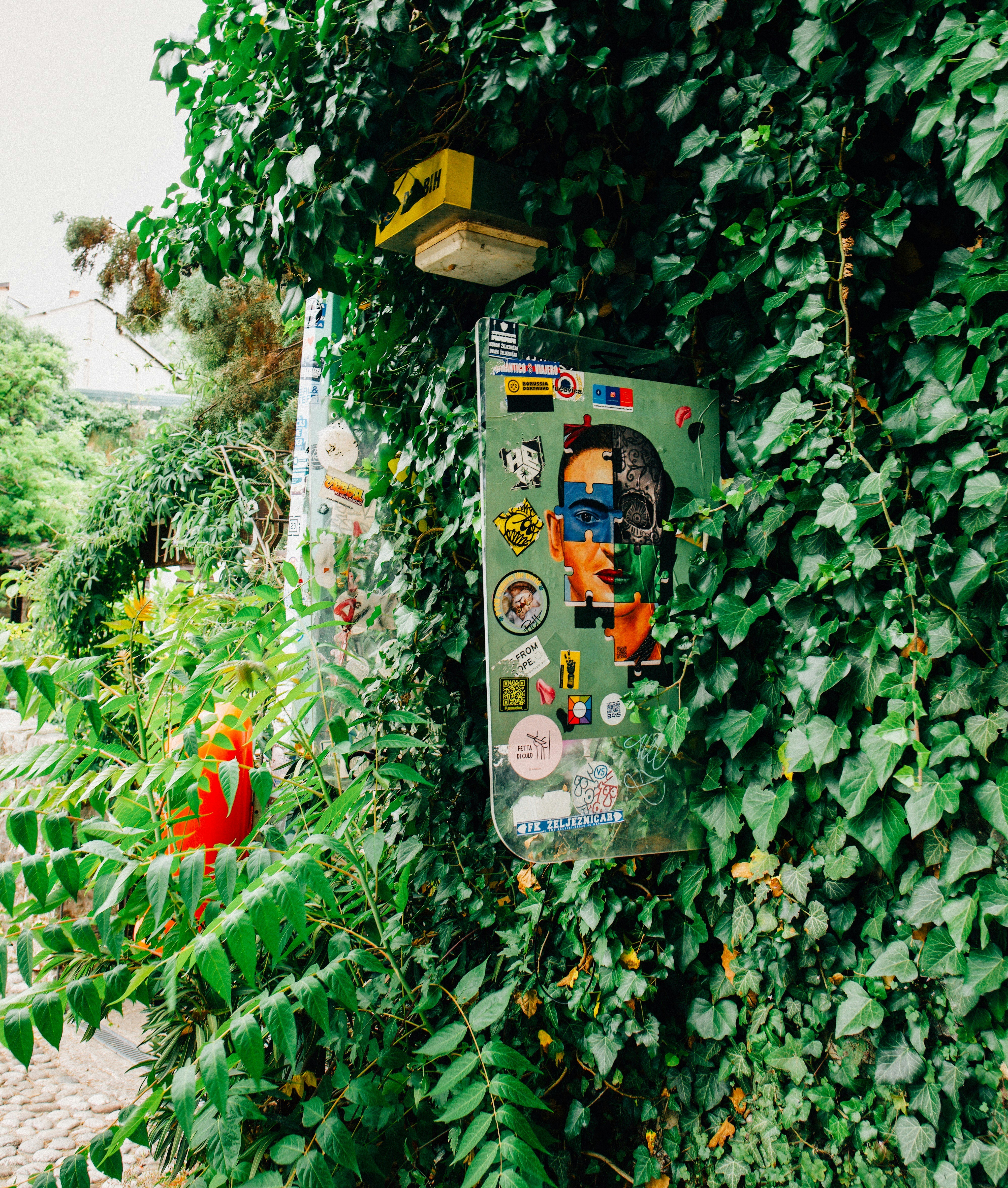 A bunch of stickers that are on a wall photo – Free Mostar Image on ...