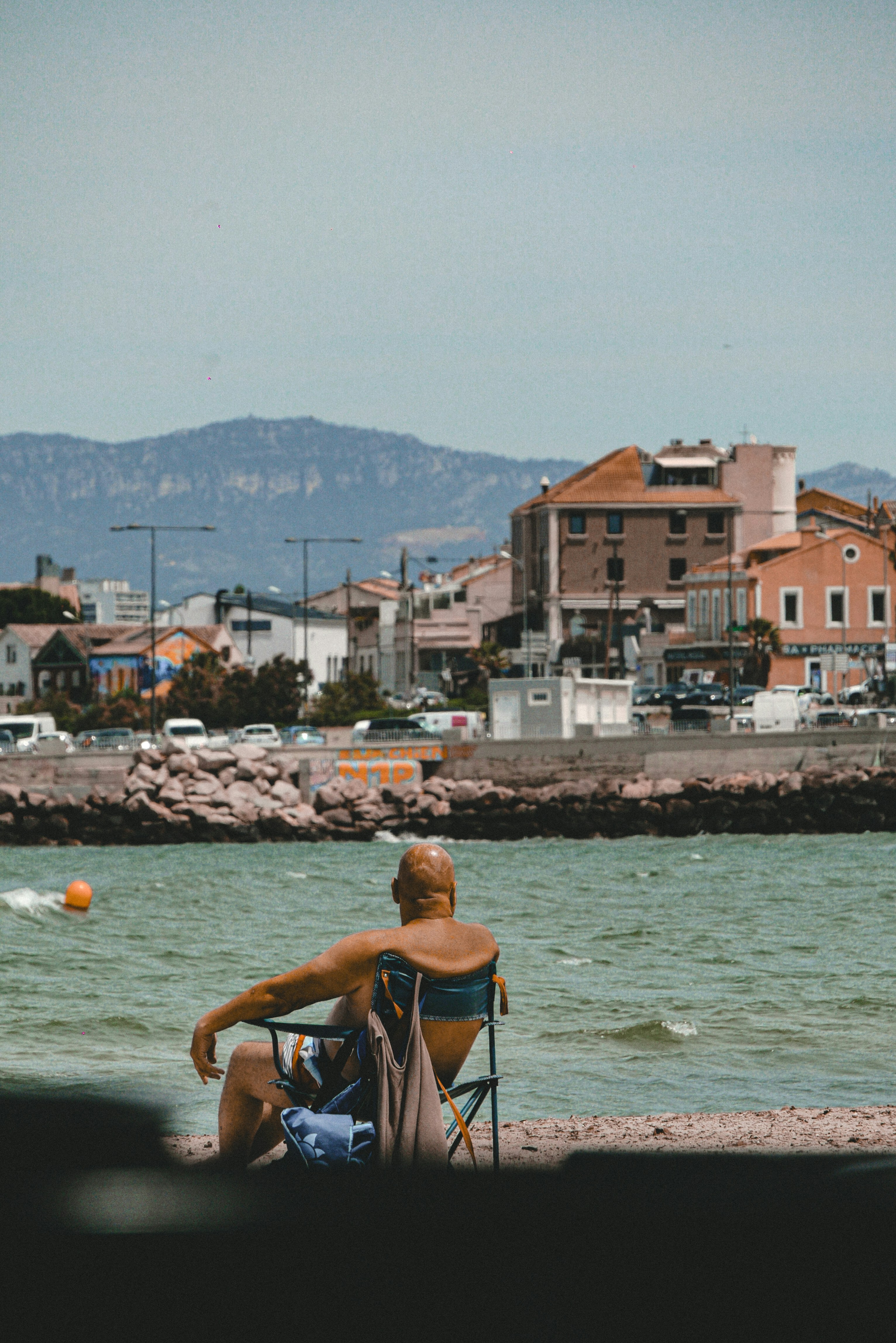 Seaside Vigil: A Man in a Lounge Chair Overlooking the Horizon