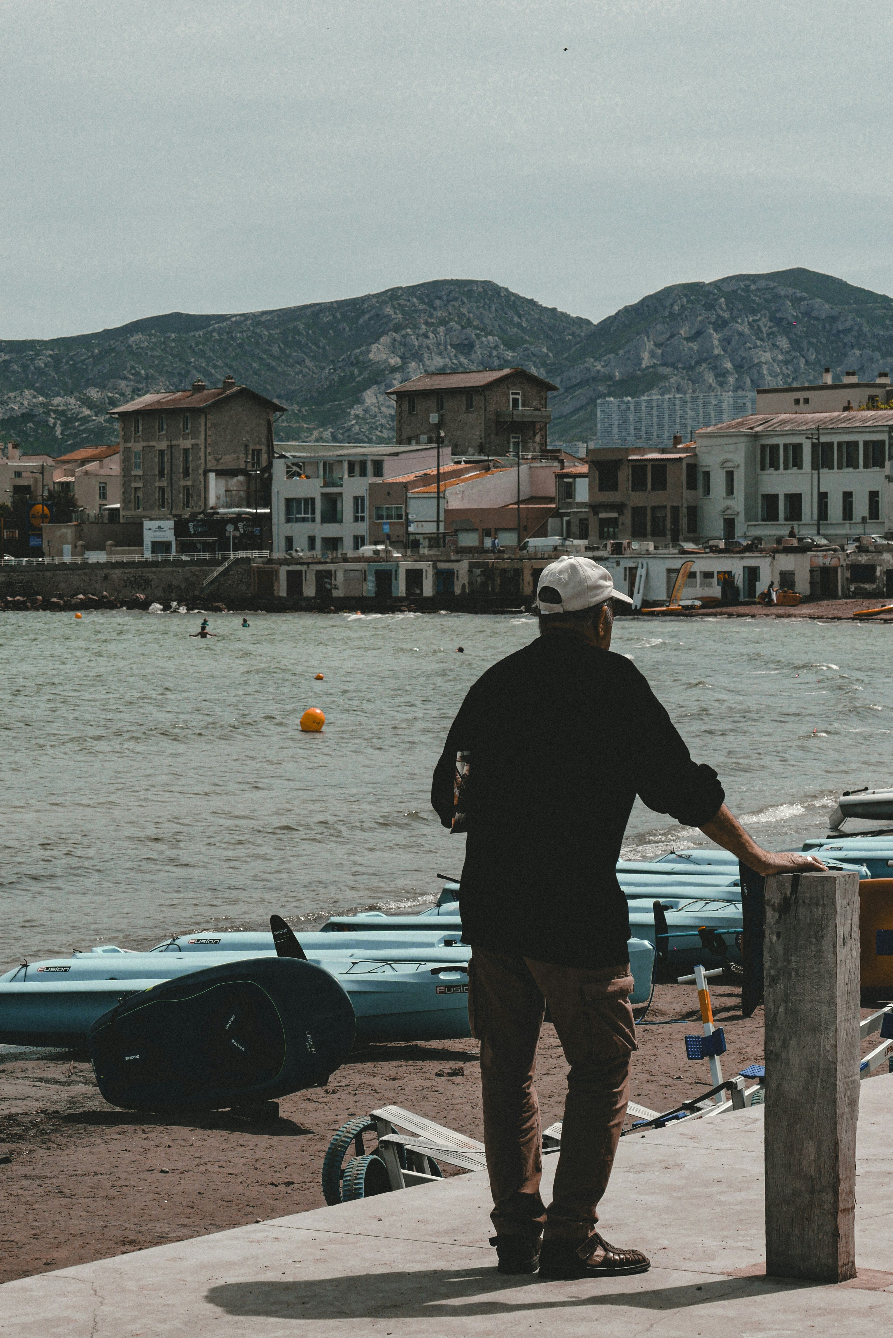 Dockside Reverie: The Figure at the Harbor's Edge