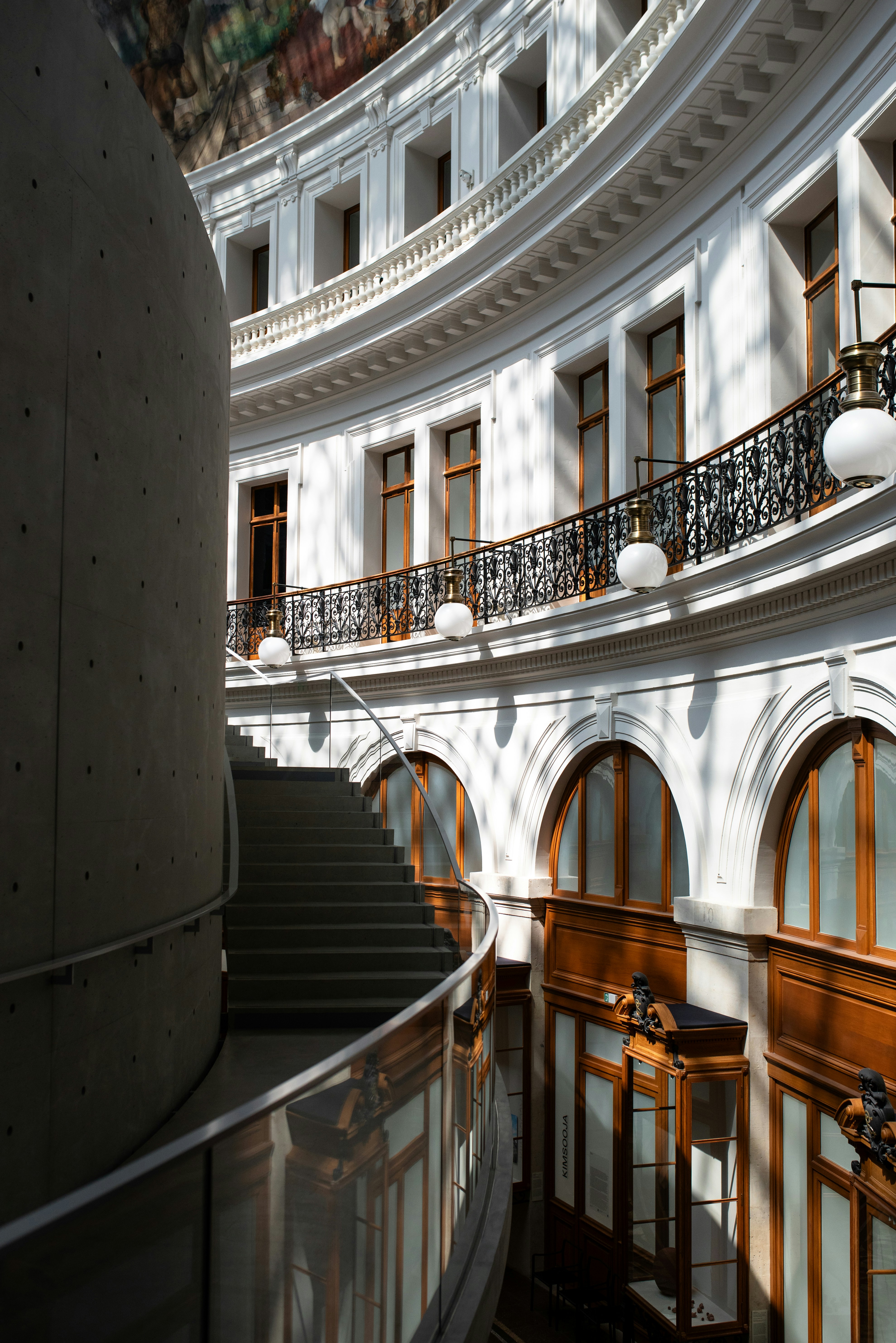 A circular building with a staircase and a balcony photo – Free Paris ...