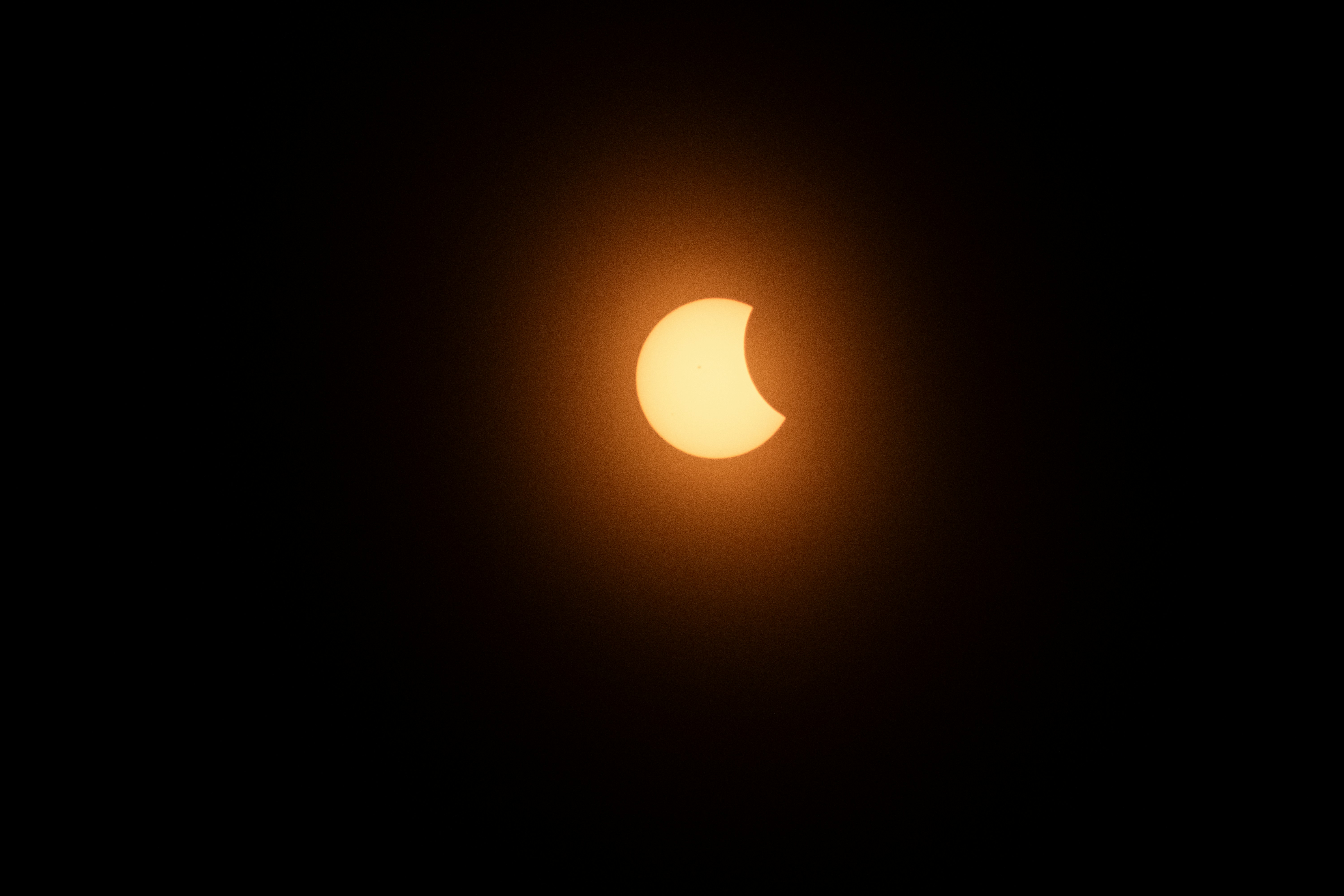 A partial solar eclipse seen through a telescope lens photo – Free Eclipse Image on Unsplash