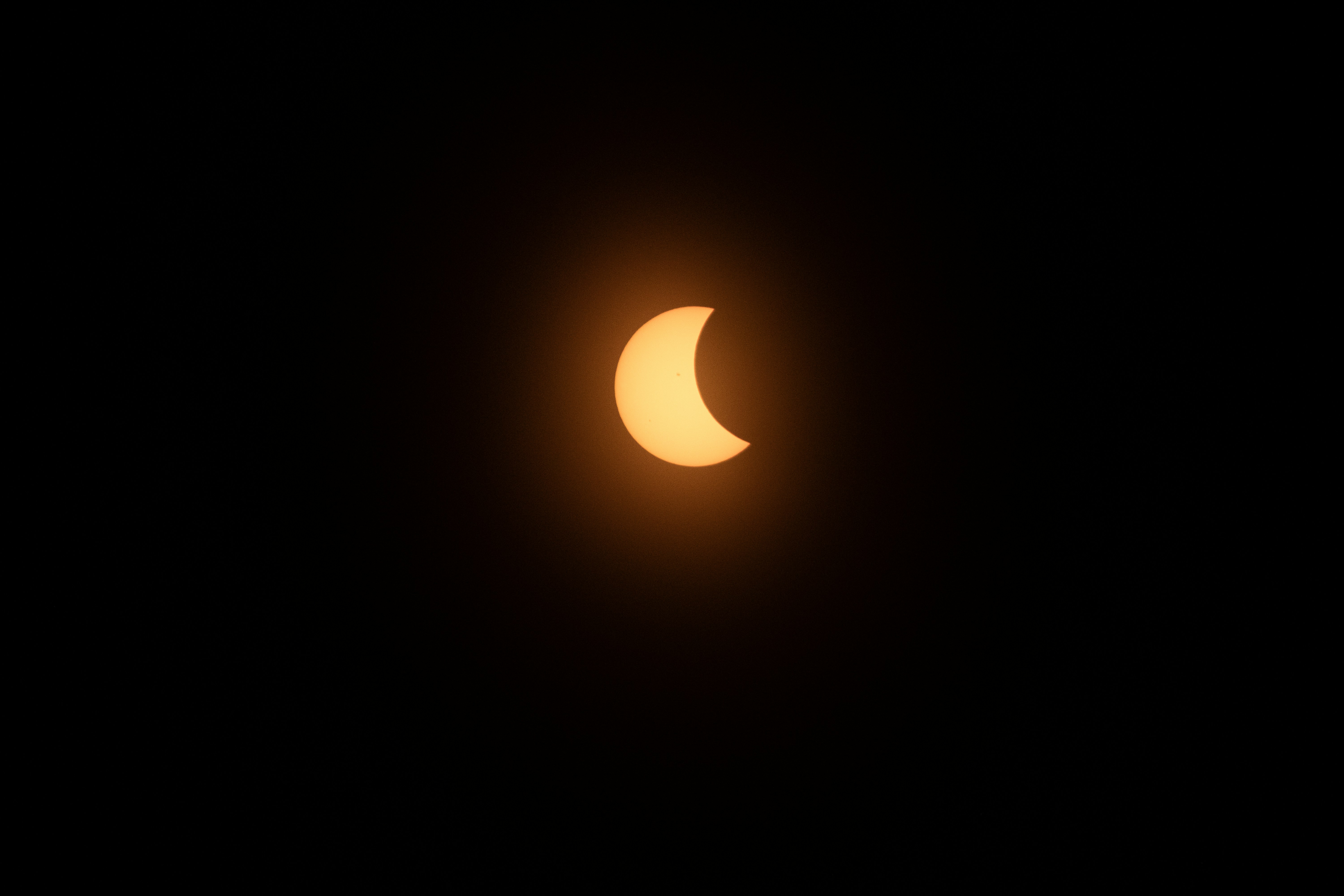 Crescent Sol: A Quiet Eclipse Through Night's Veil