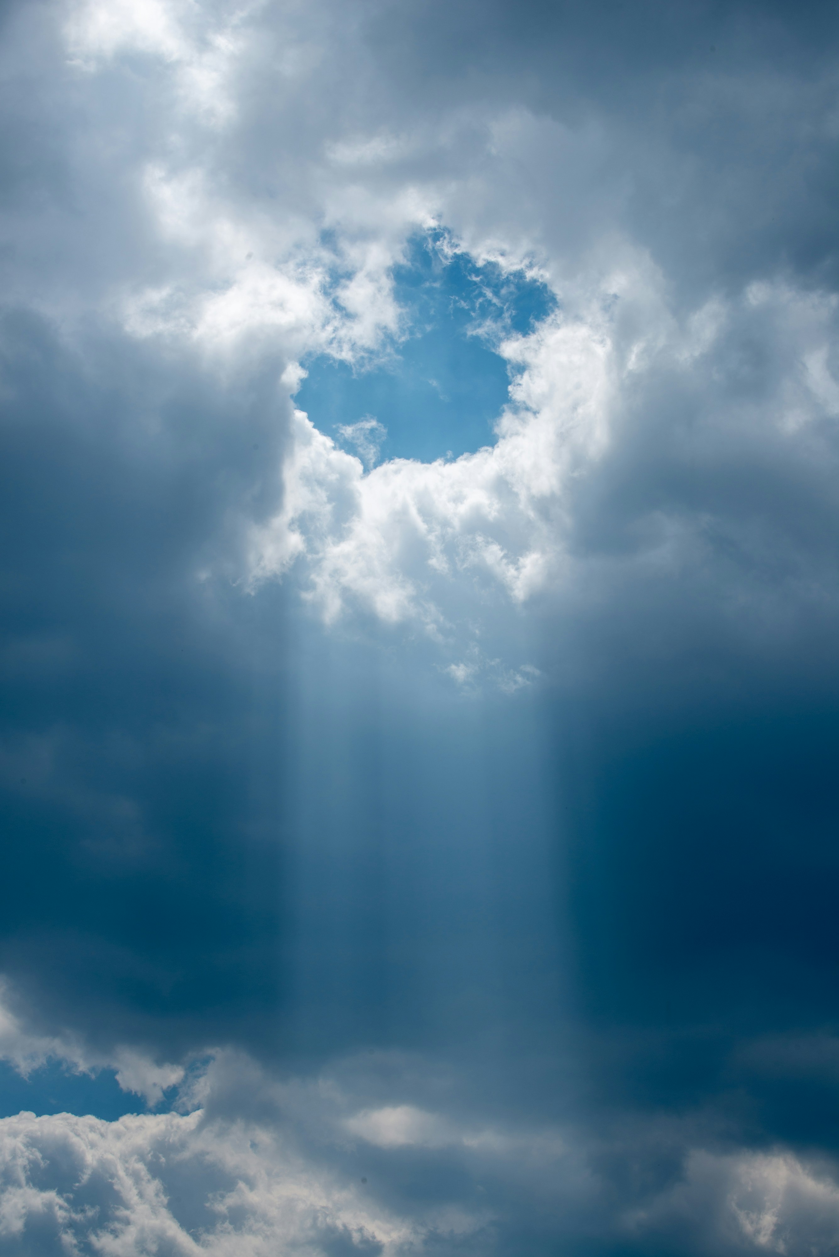 the sun is shining through the clouds in the sky