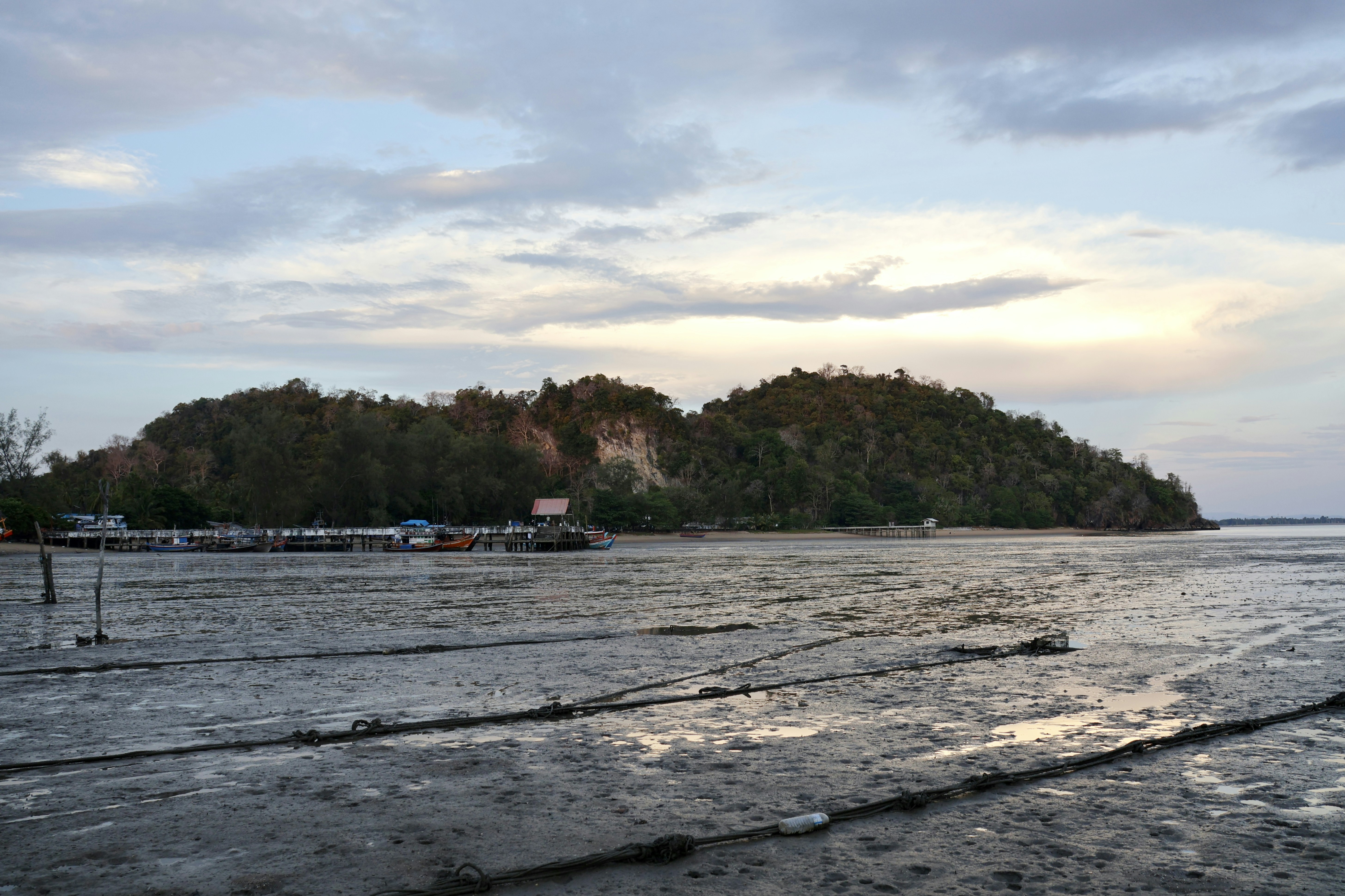 A beautiful picture of the tide on the ebb, revealing the muddy sand left behind.