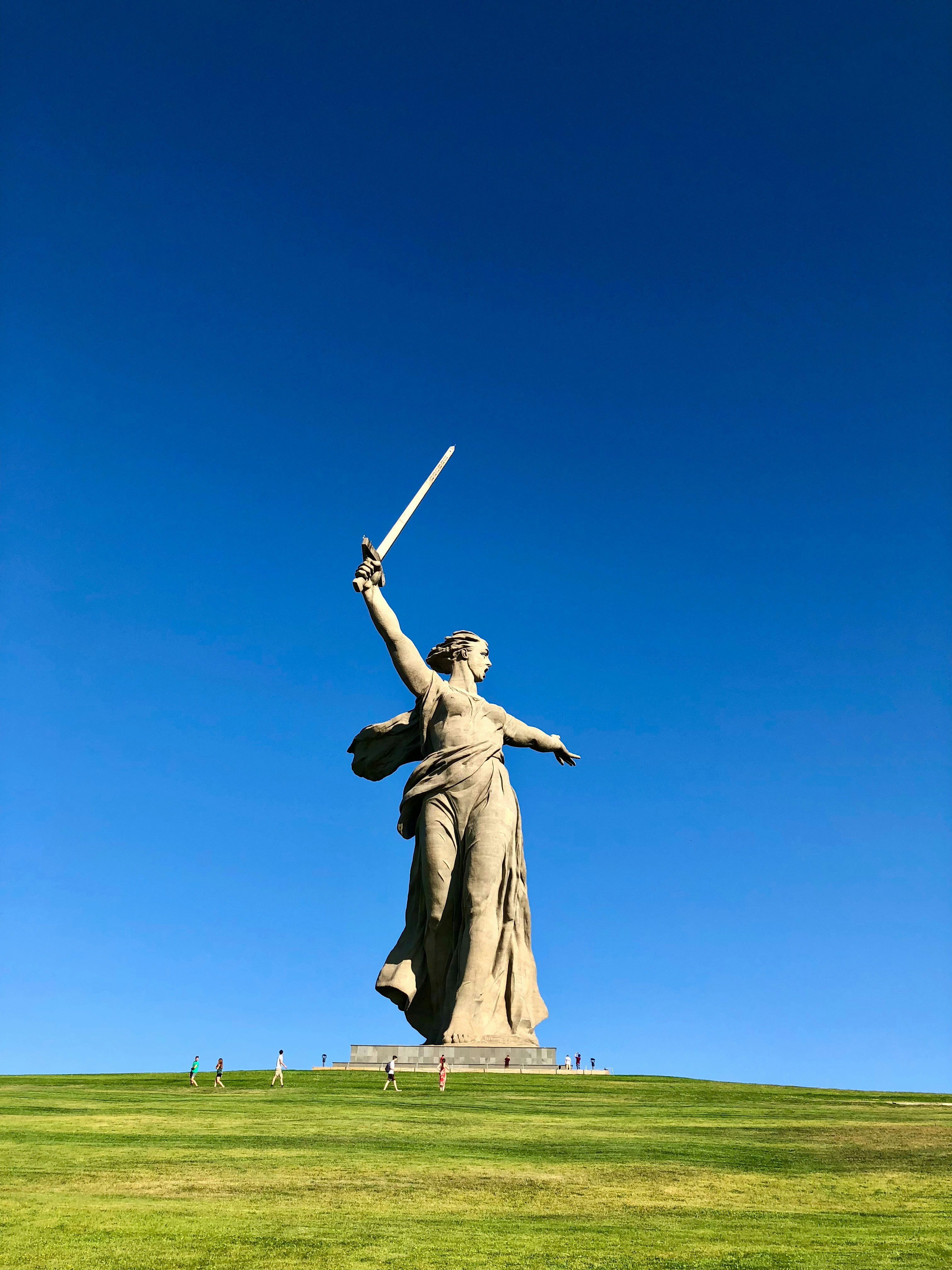 A statue of a woman holding a sword photo – Free Volgograd Image on Unsplash