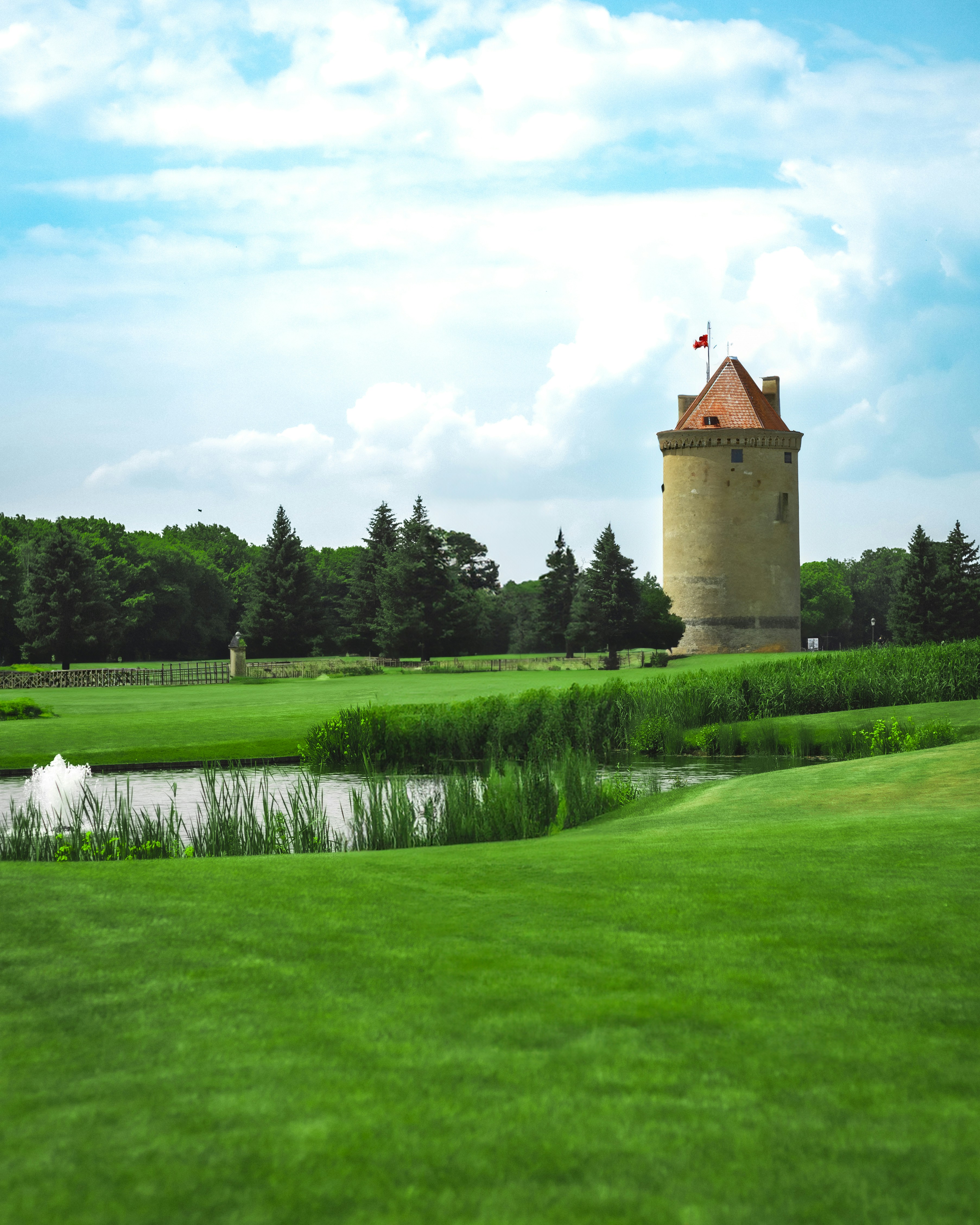 Turret by the Greens: A serene fairway under a bright sky