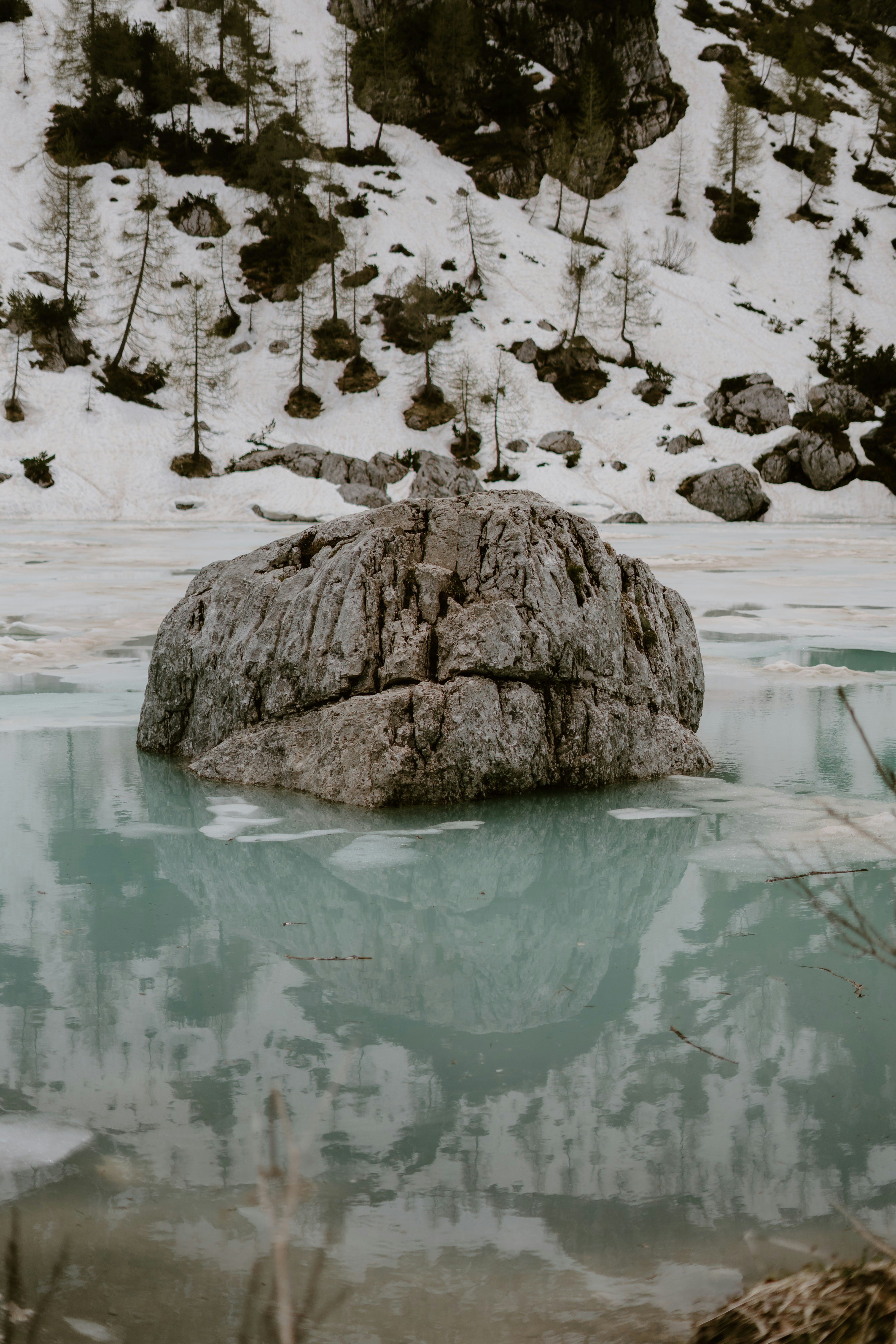 Lone Rock in a Mint-Tinted Icy Lake