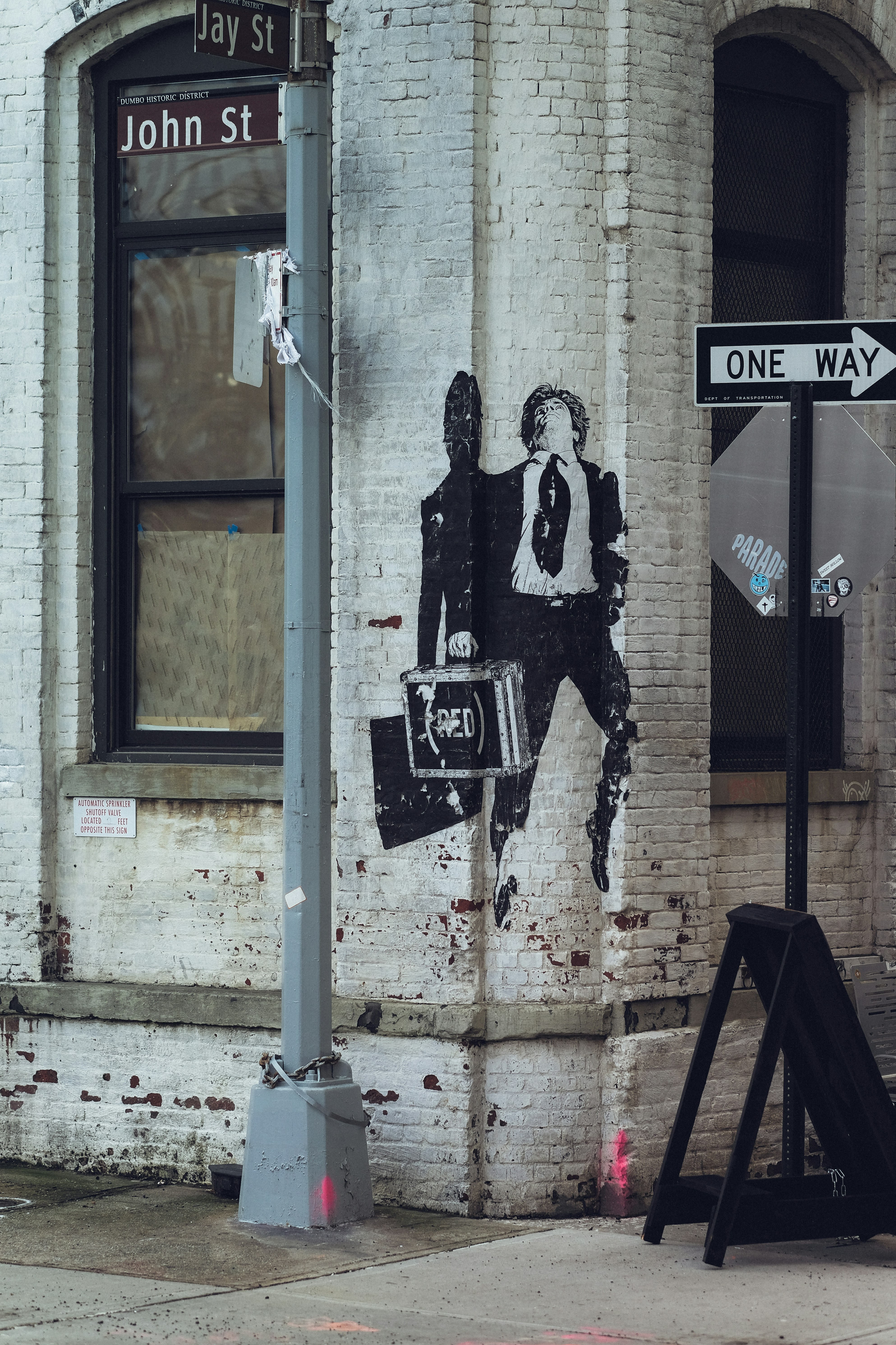 Urban Left-Behind: A Graffiti Silhouette at a Corner