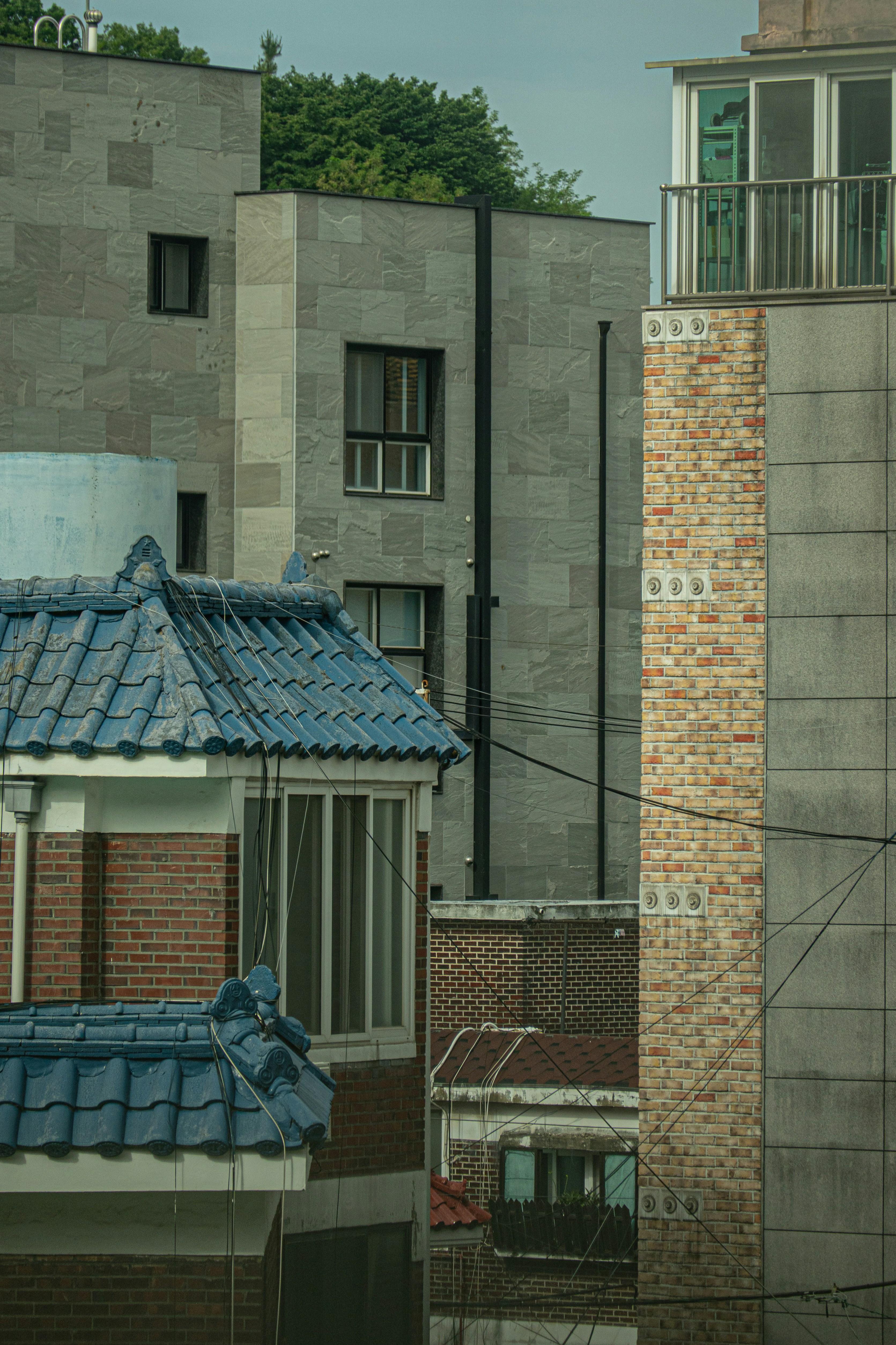 a view of a building with a clock tower in the background