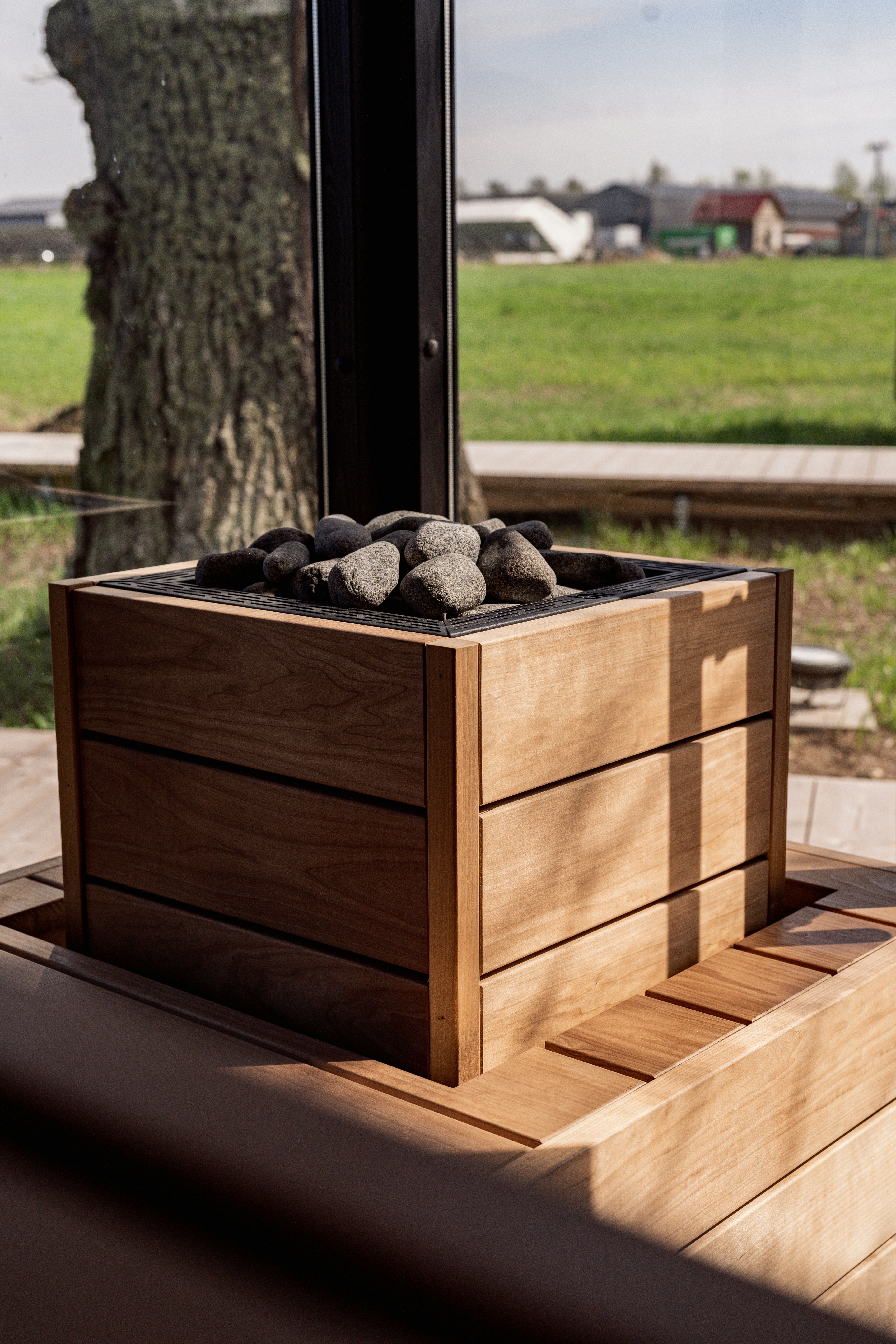 A wooden box with rocks in it on a deck photo – Free Stones in heater ...