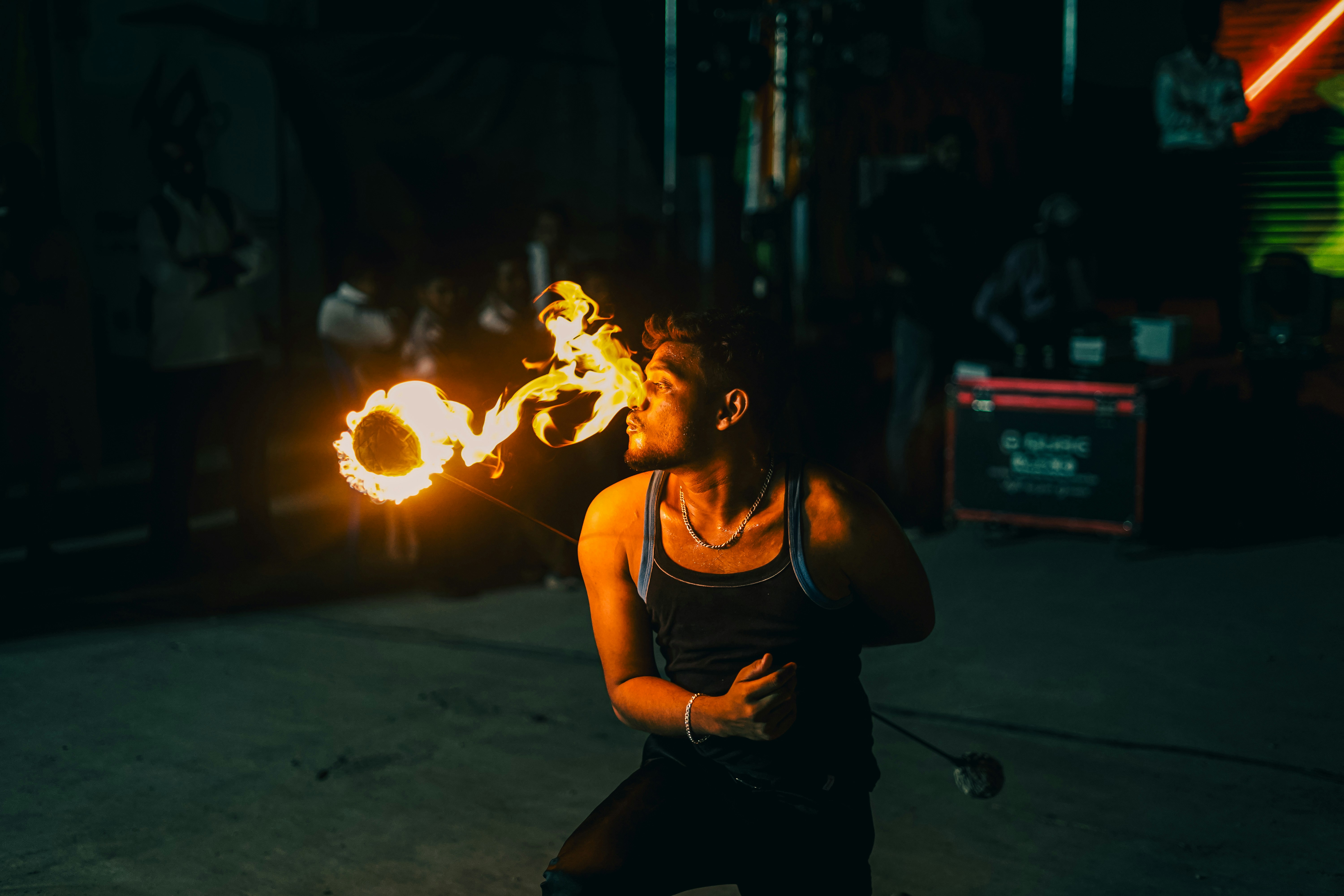 A man holding a fire stick in his hand photo – Free Fire background ...