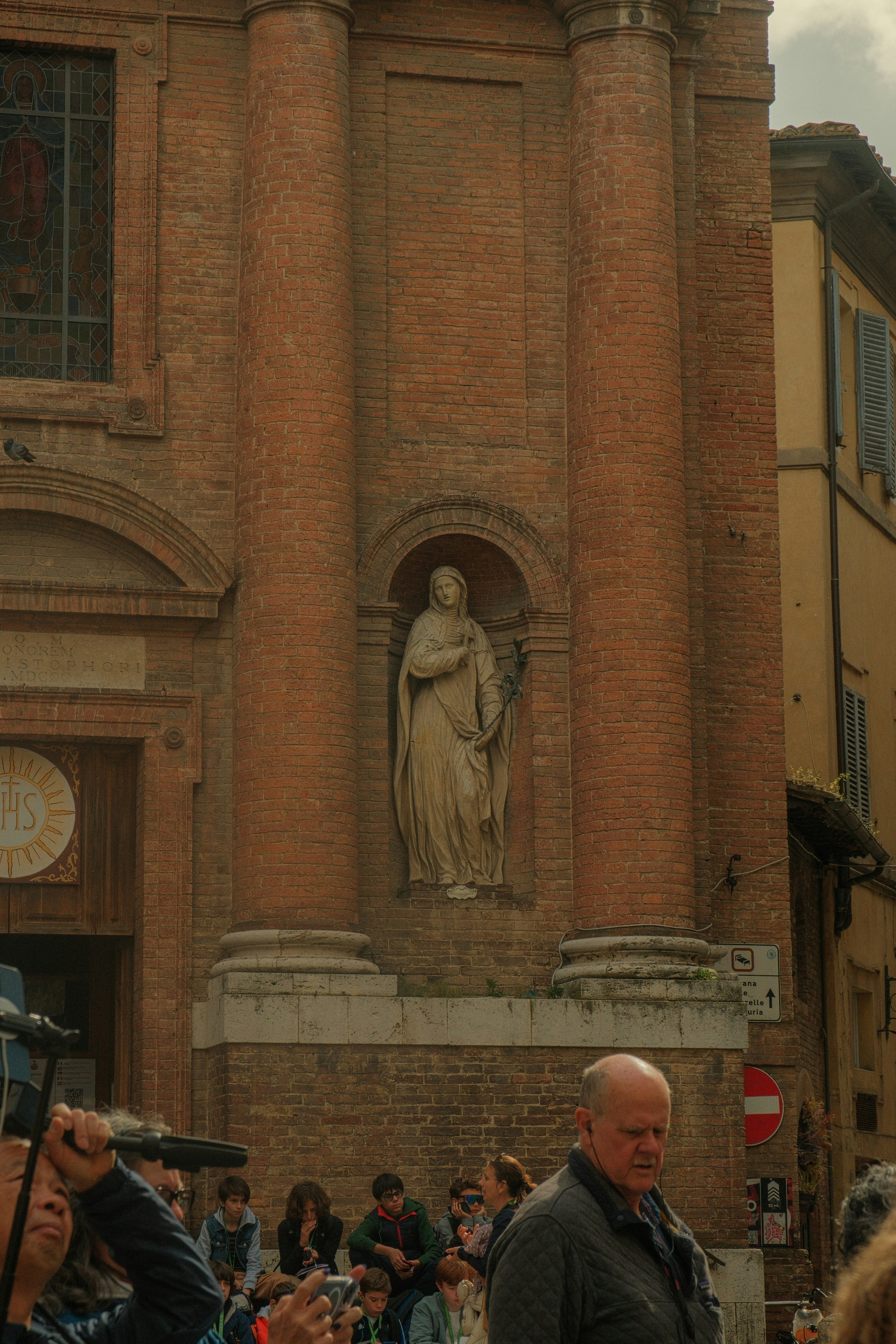 a group of people standing in front of a building