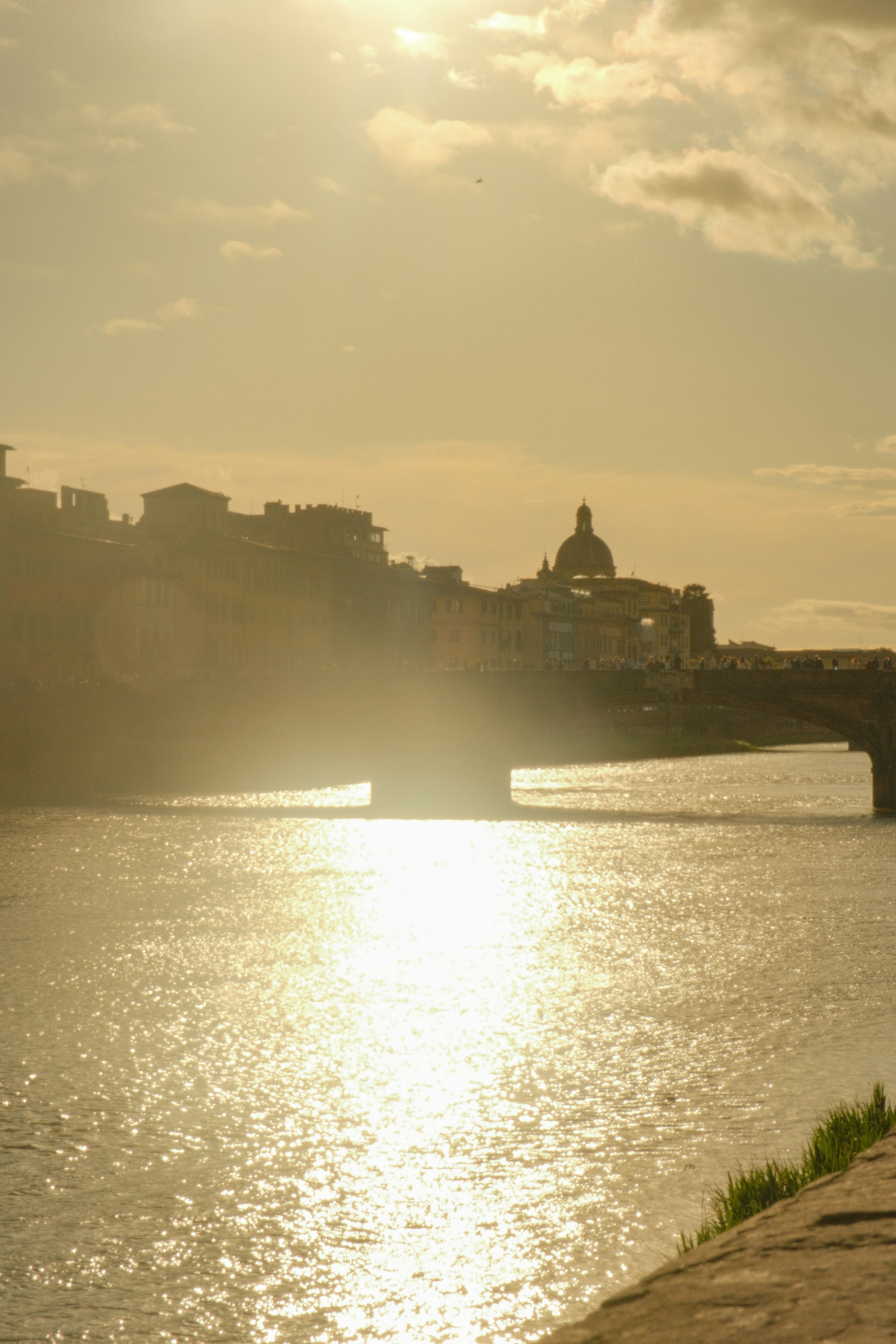 Golden Riverside Dusk Over a Classic City Skyline