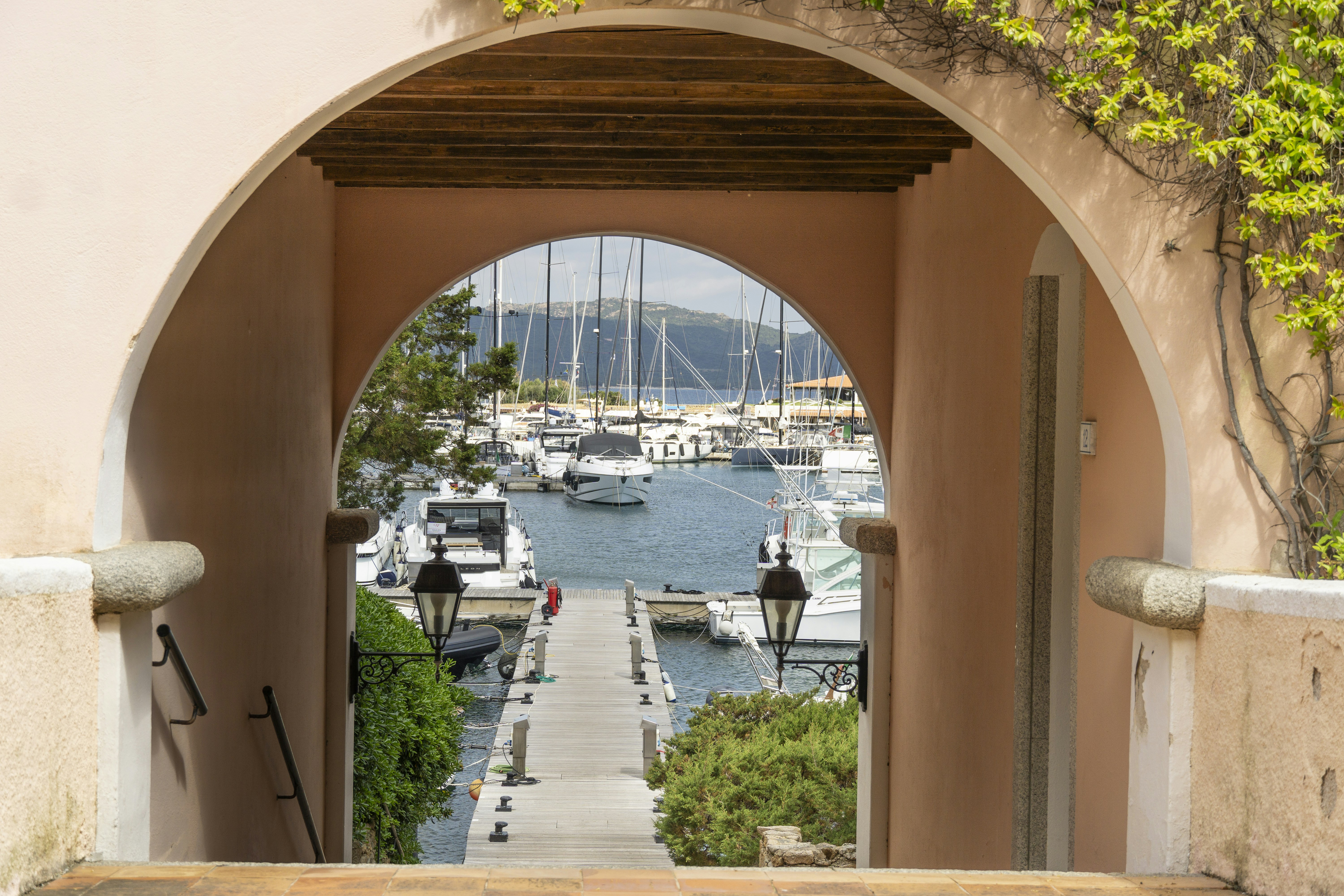 Harbor Framed by a Sunlit Archway