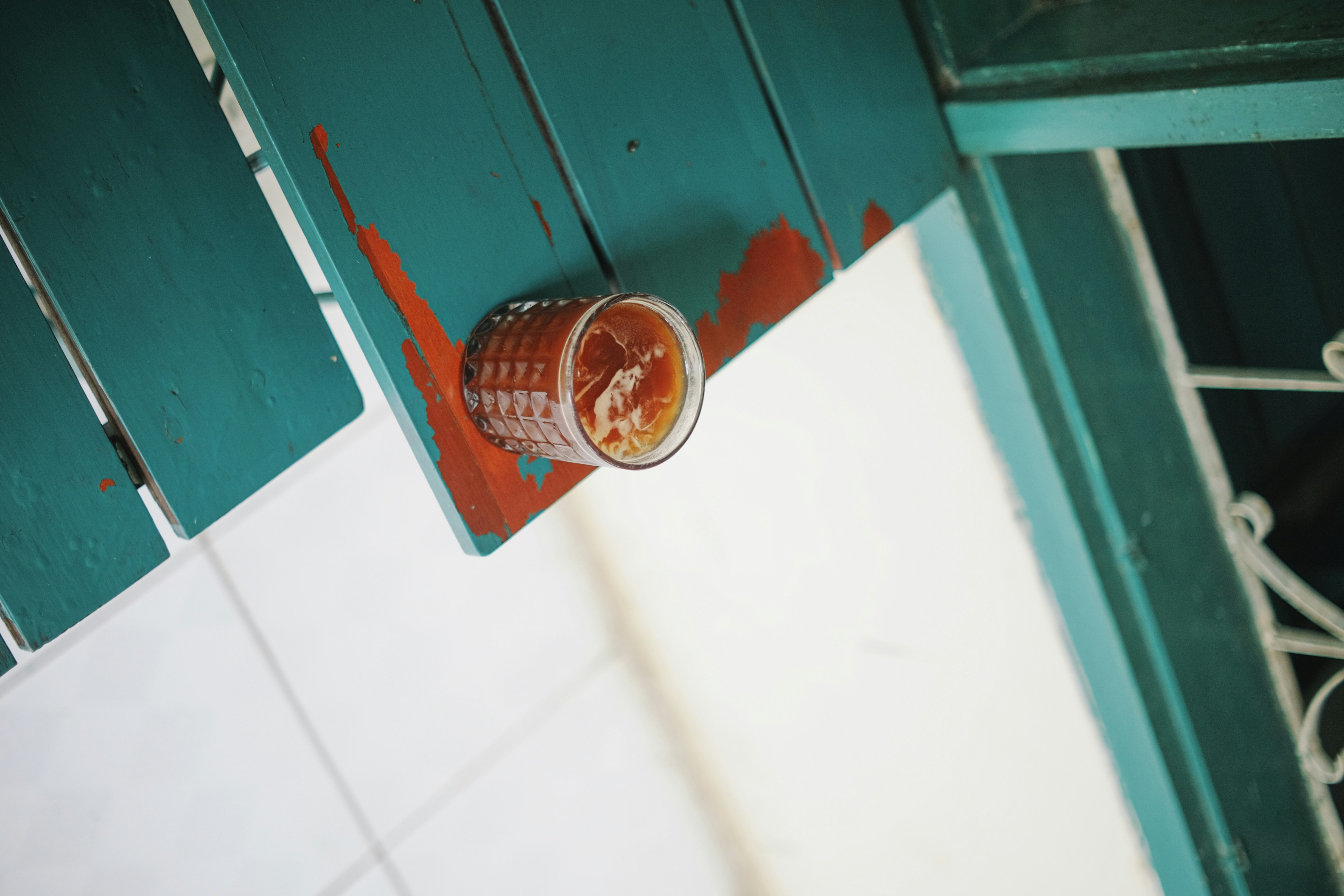 Teal Gate, Rusted Lock: A Close-Up of Time on a Weathered Door