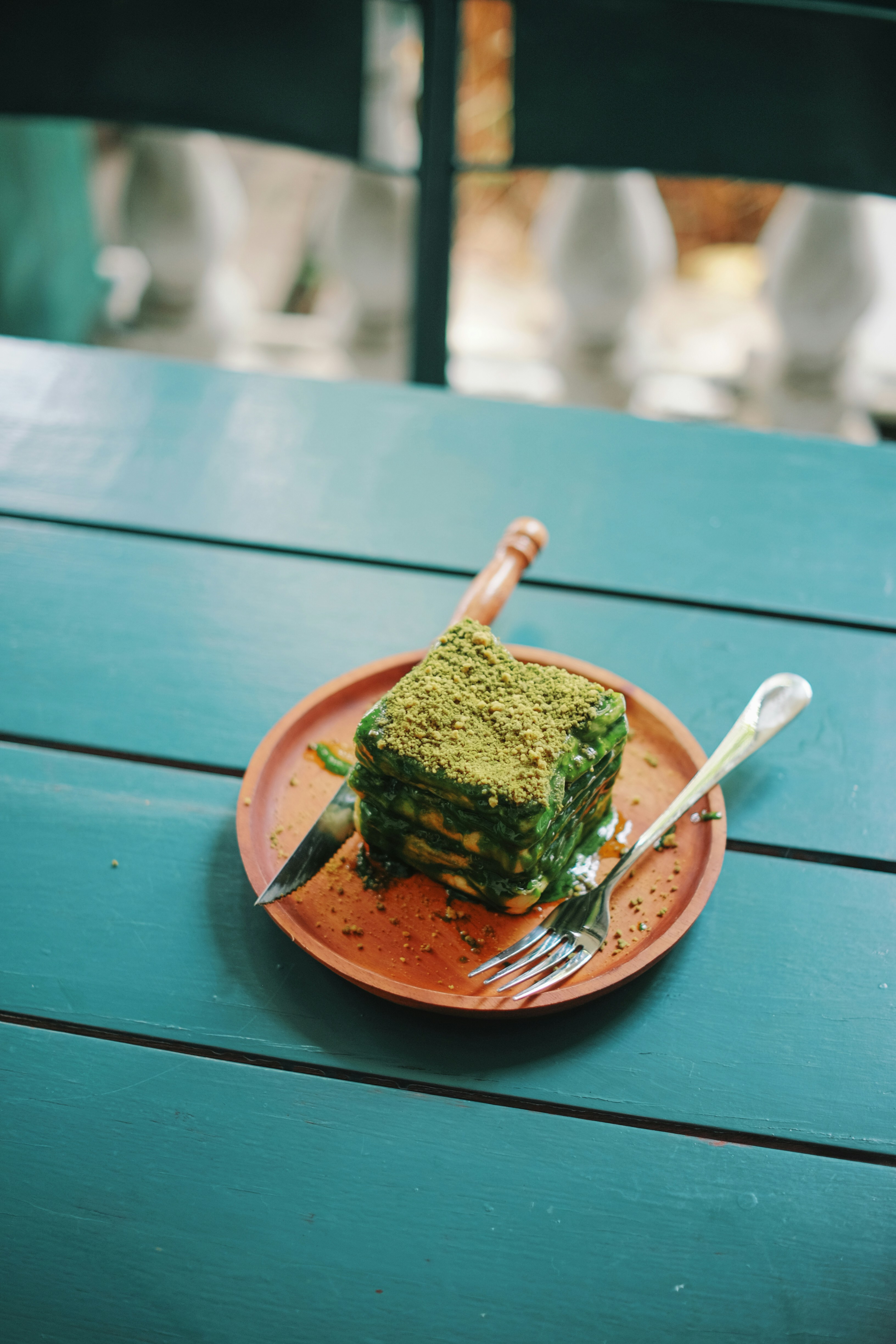 Verdant Matcha Mille-Feuille on a Teal Table