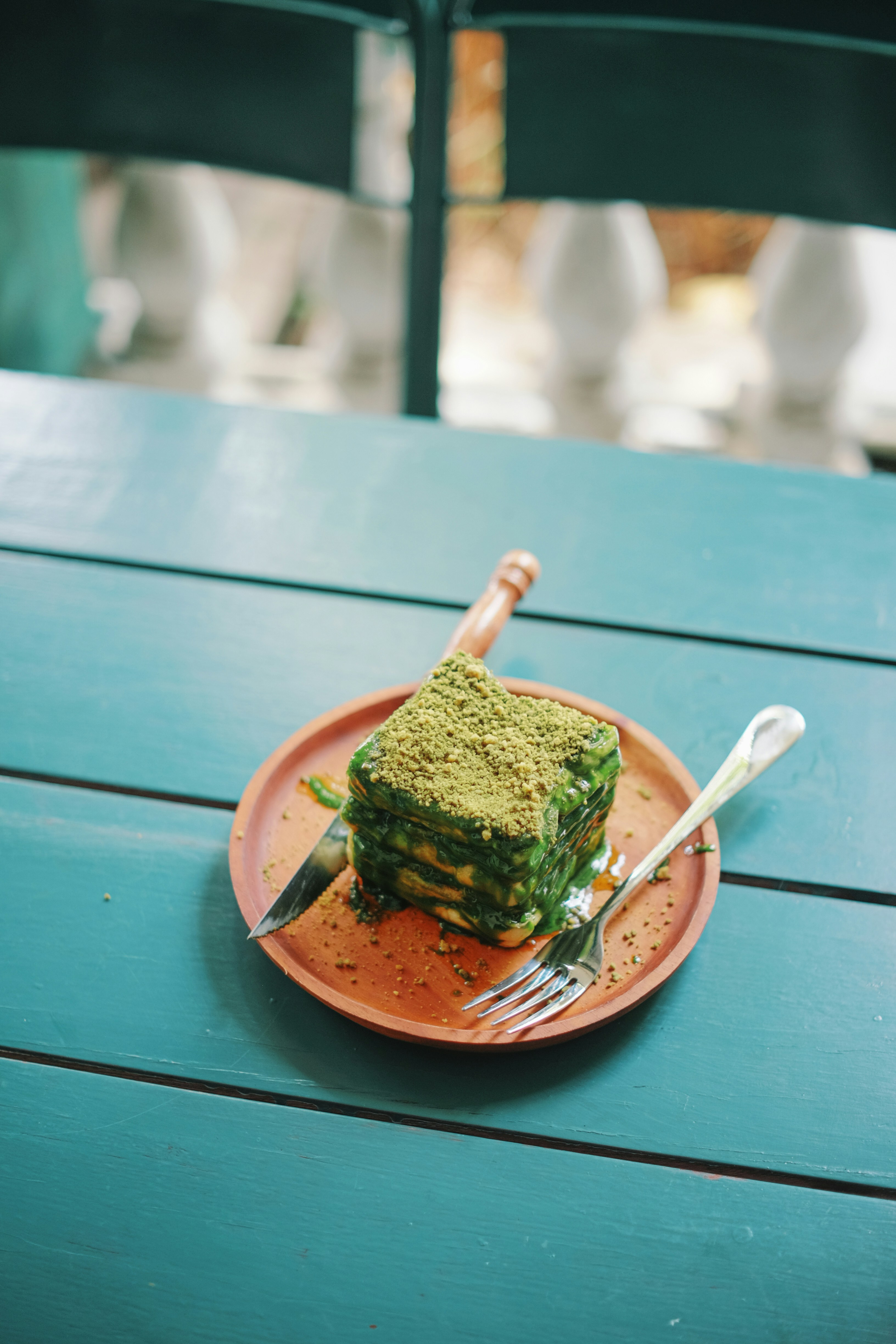 Verdant Matcha Layer Cake on a Teal Table
