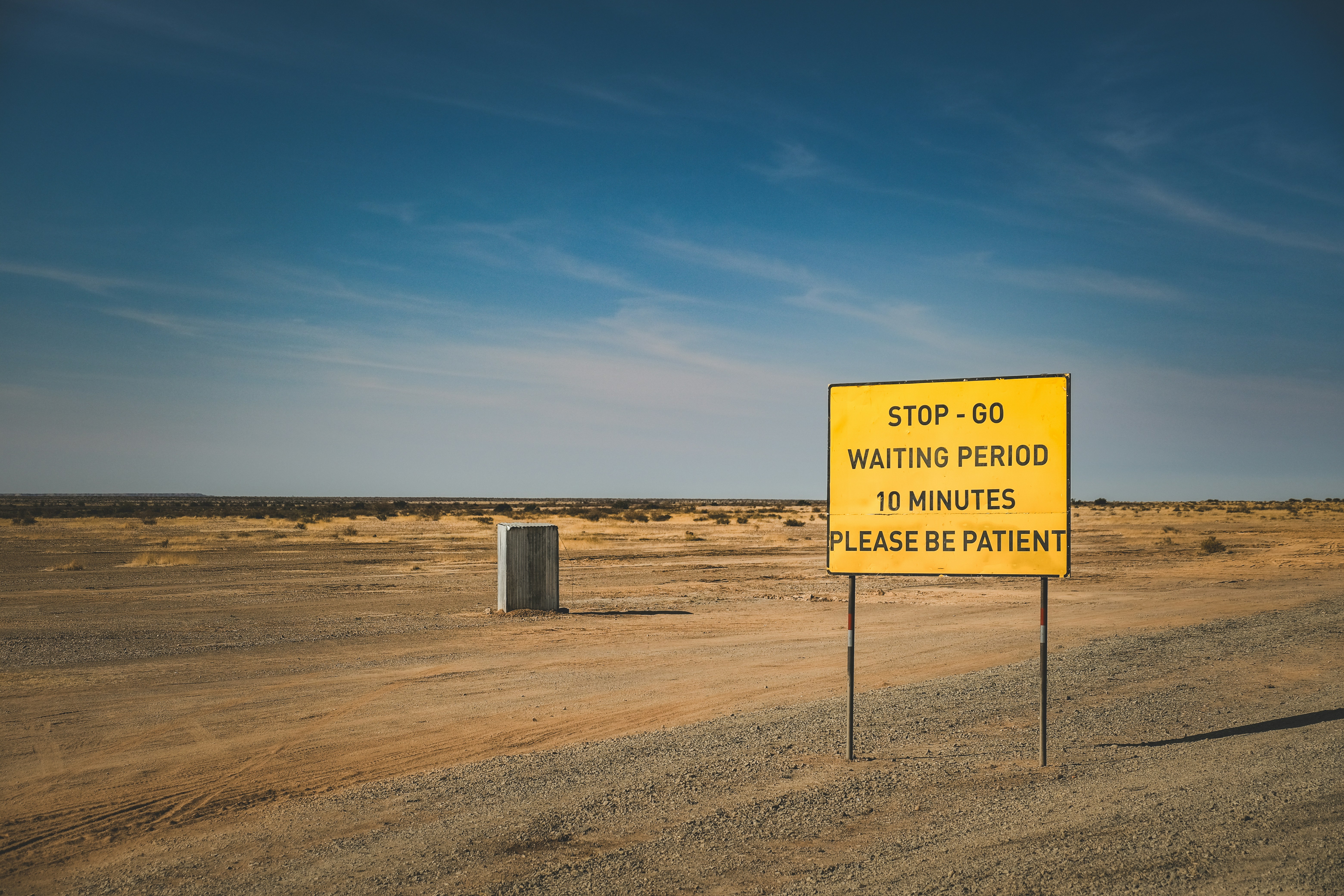 Desert Signpost in Quiet Distant Plain