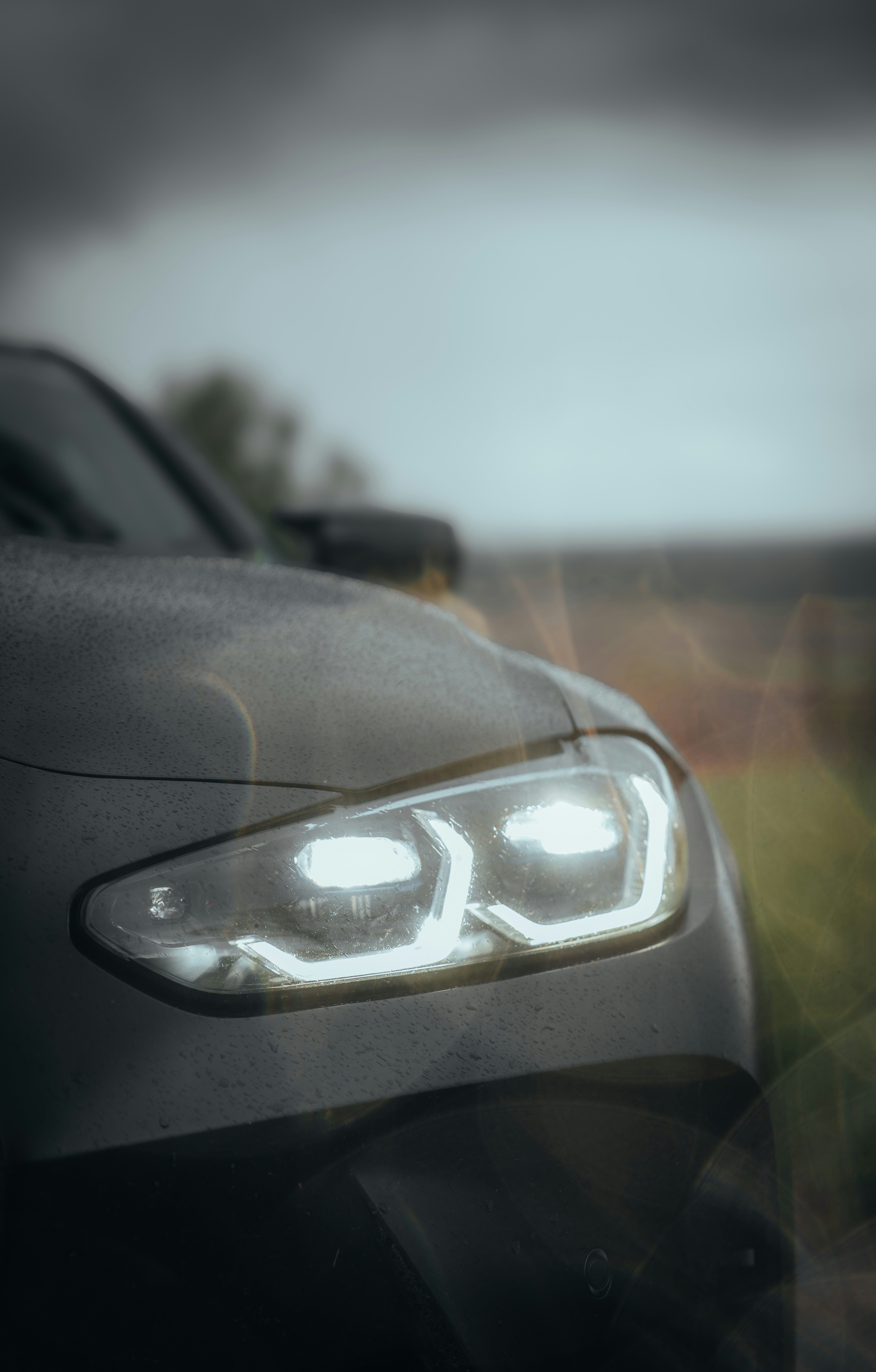 Rain-Kissed Headlamp: A Close-Up in Stormy Light